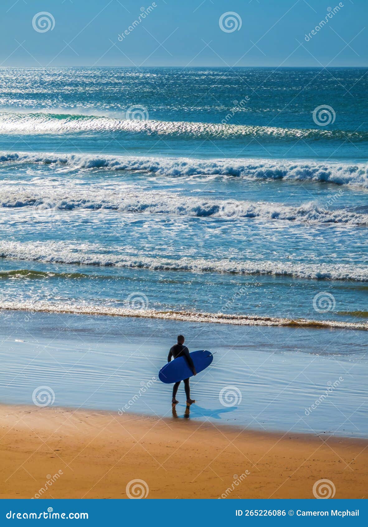 Surfer Carrying Surfboard into the Surf Stock Photo - Image of solo ...