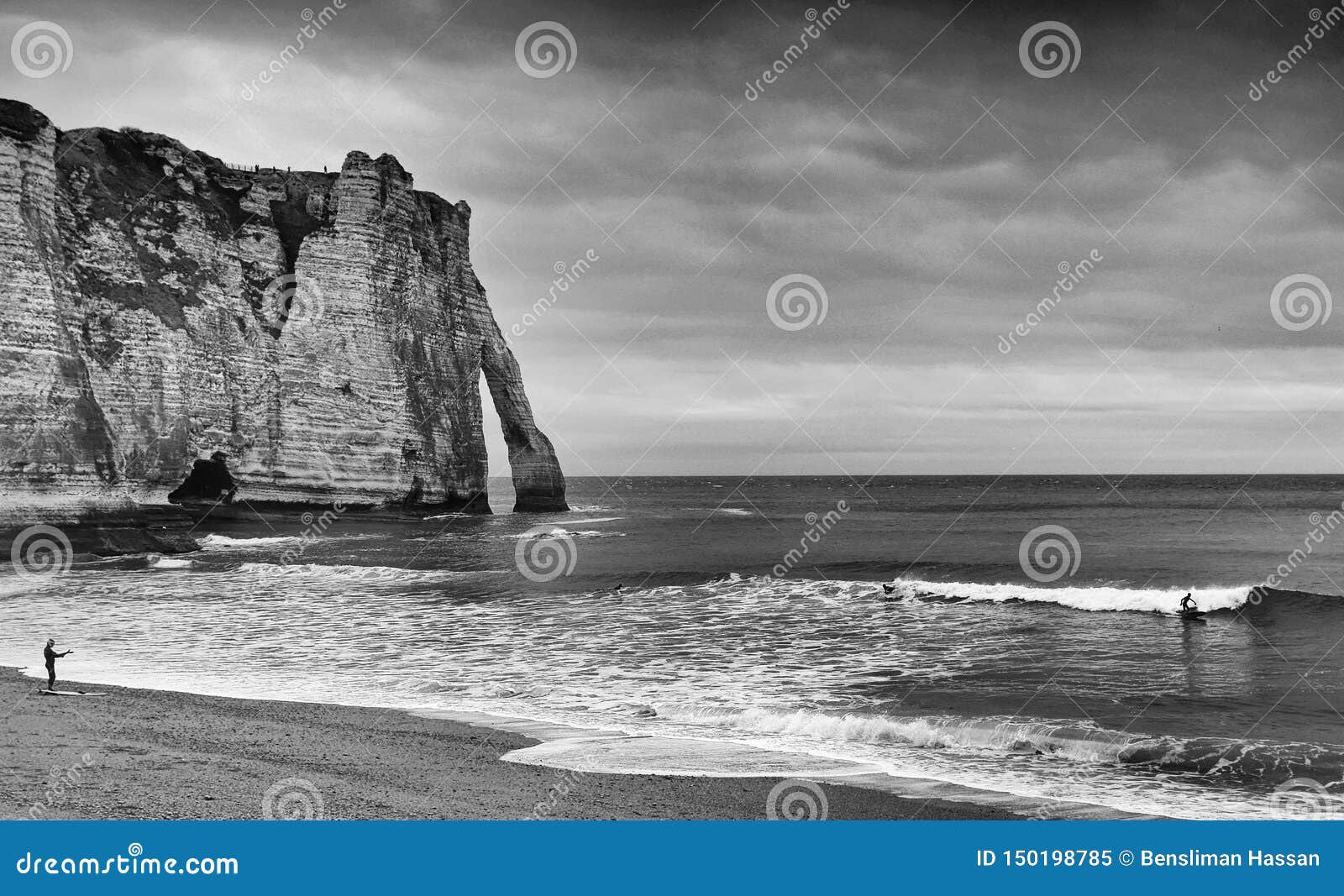 Surfer in Etretat beach stock image. Image of outdoor - 150198785