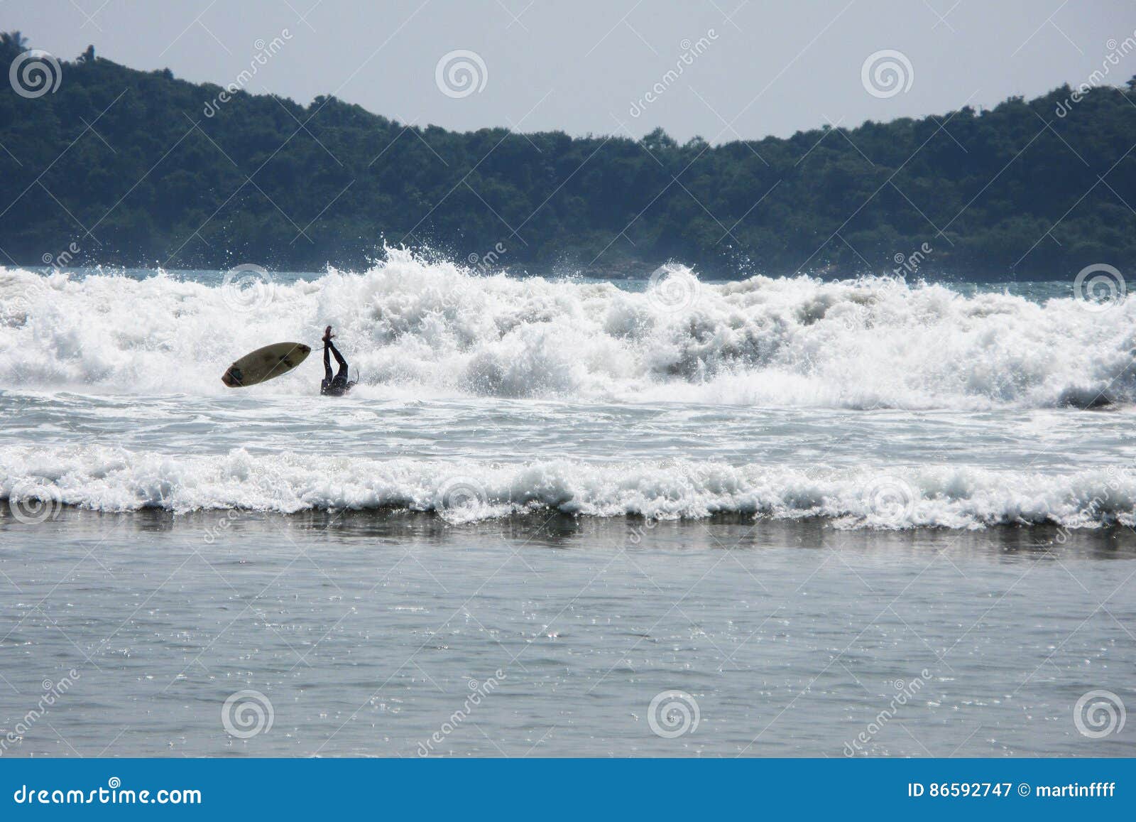 Surfer falling into waves stock image. Image of balance - 86592747
