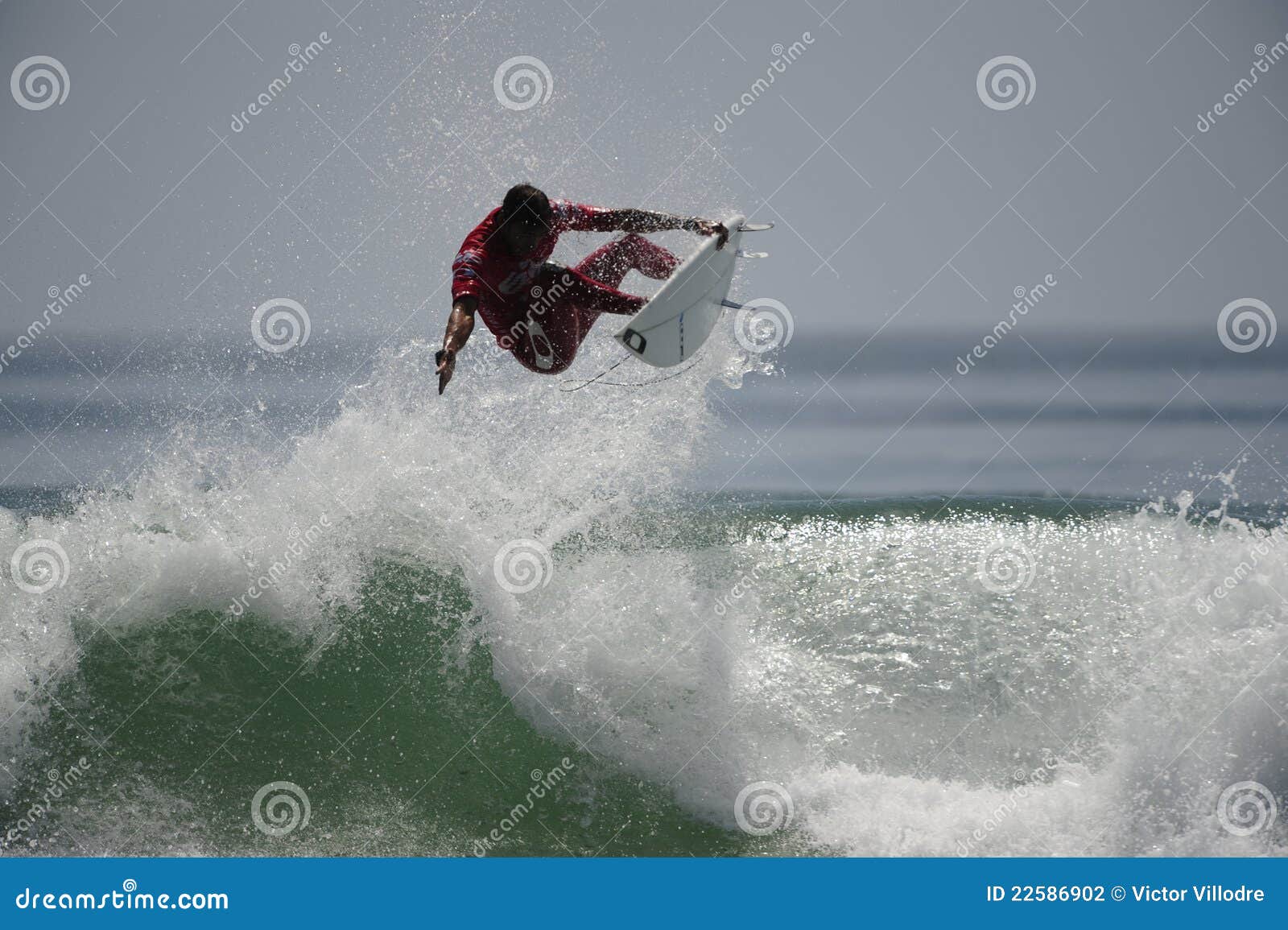 Surfer frontside air editorial photography. Image of outdoor - 22586902
