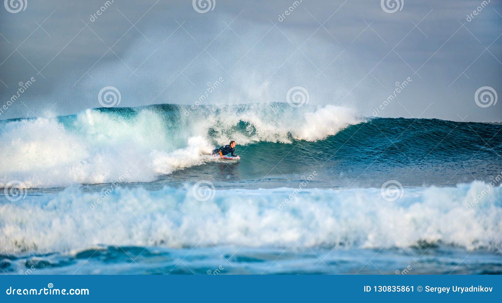 Surfer gets up on a wave. stock image. Image of nature - 130835861