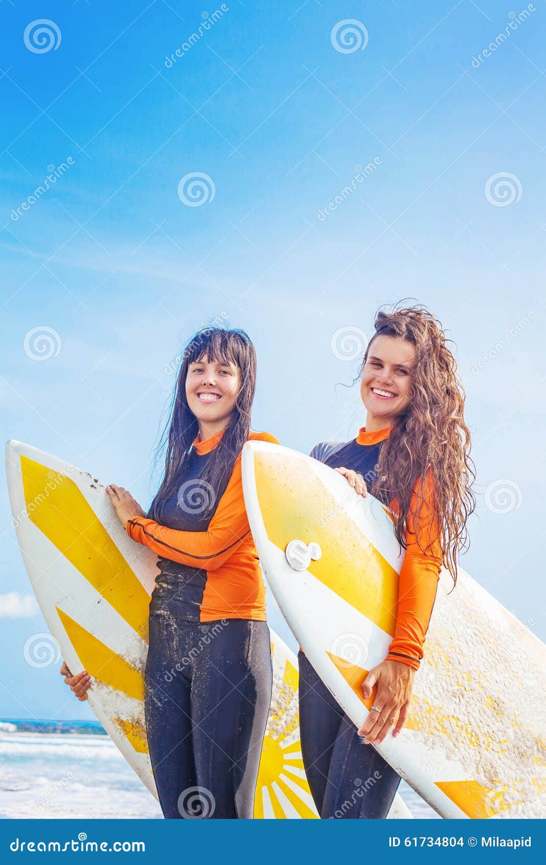 Surfer girls in Bali stock photo. Image of active, beach - 61734804