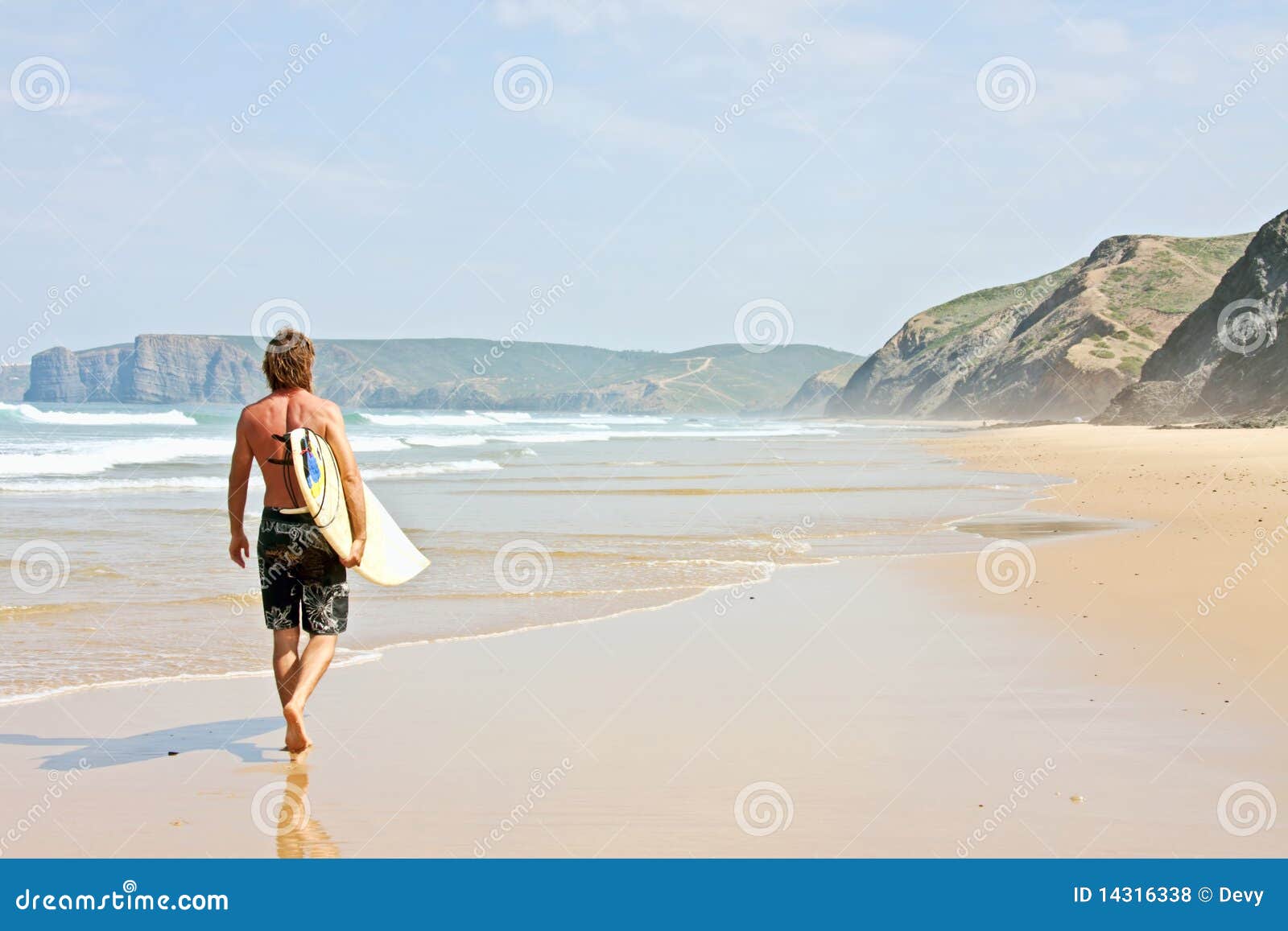 Surfer with His Surfboard Walking Along the Beach Stock Photo - Image ...