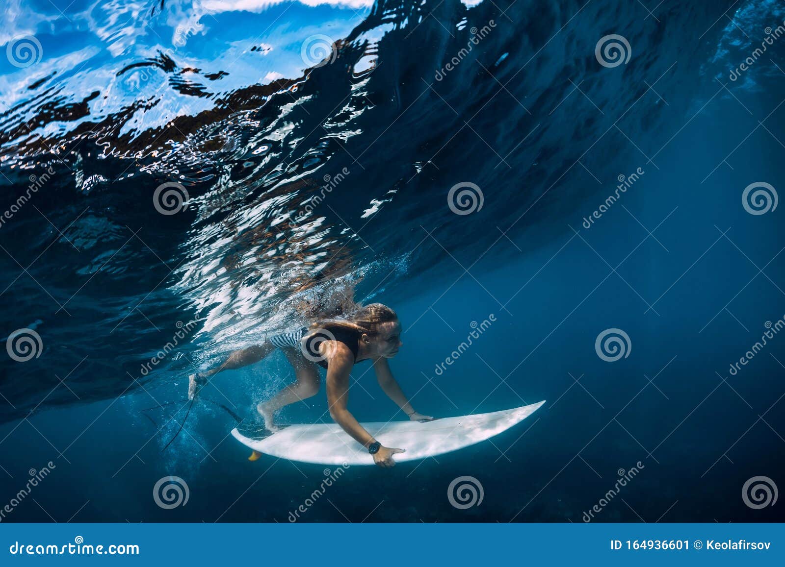 Surfer Make Duck Dive Underwater. Surfgirl Dive Under Wave Stock Image ...