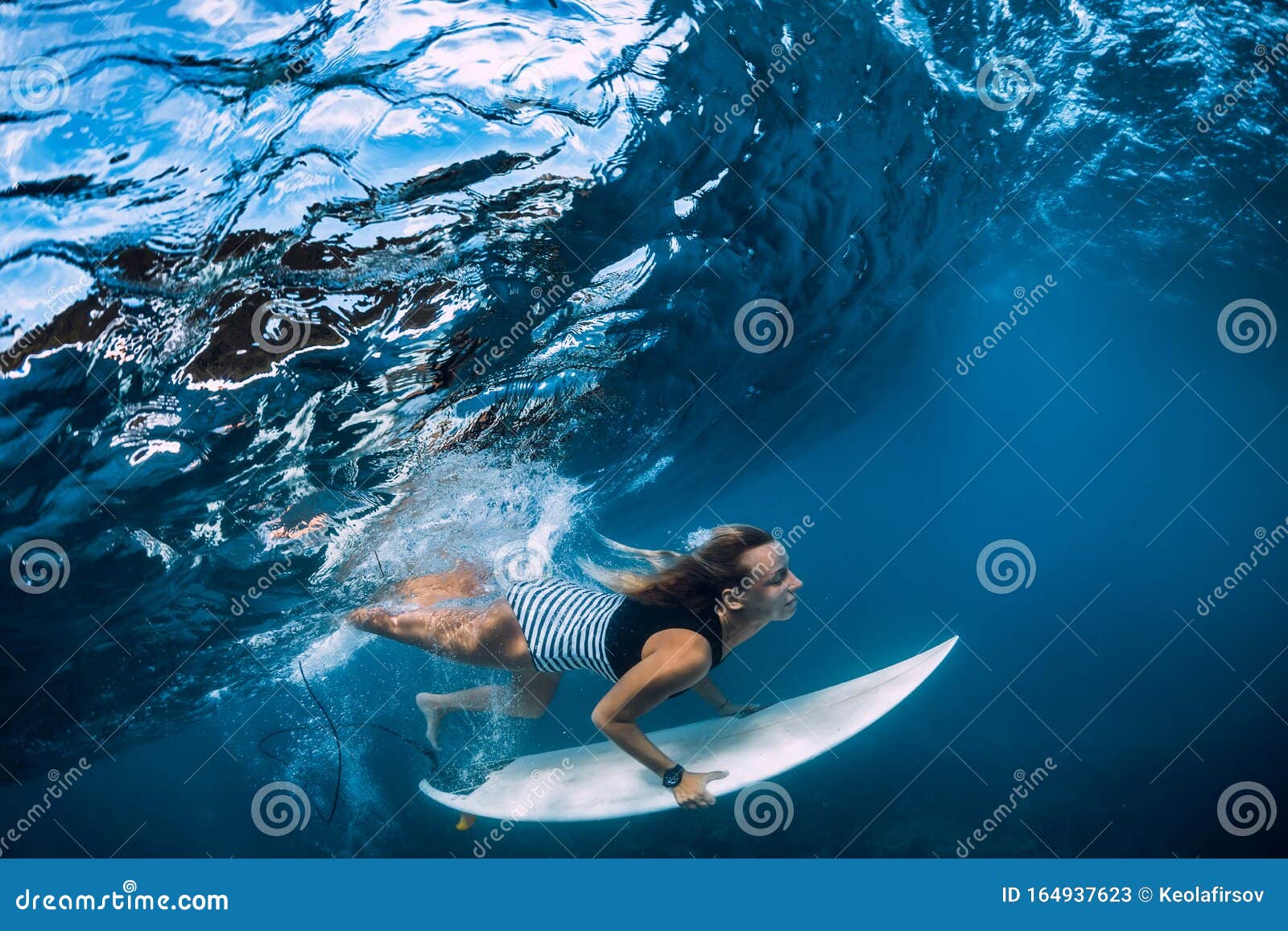 Surfer Make Duck Dive Underwater. Surfgirl Dive Under Wave Stock Image ...
