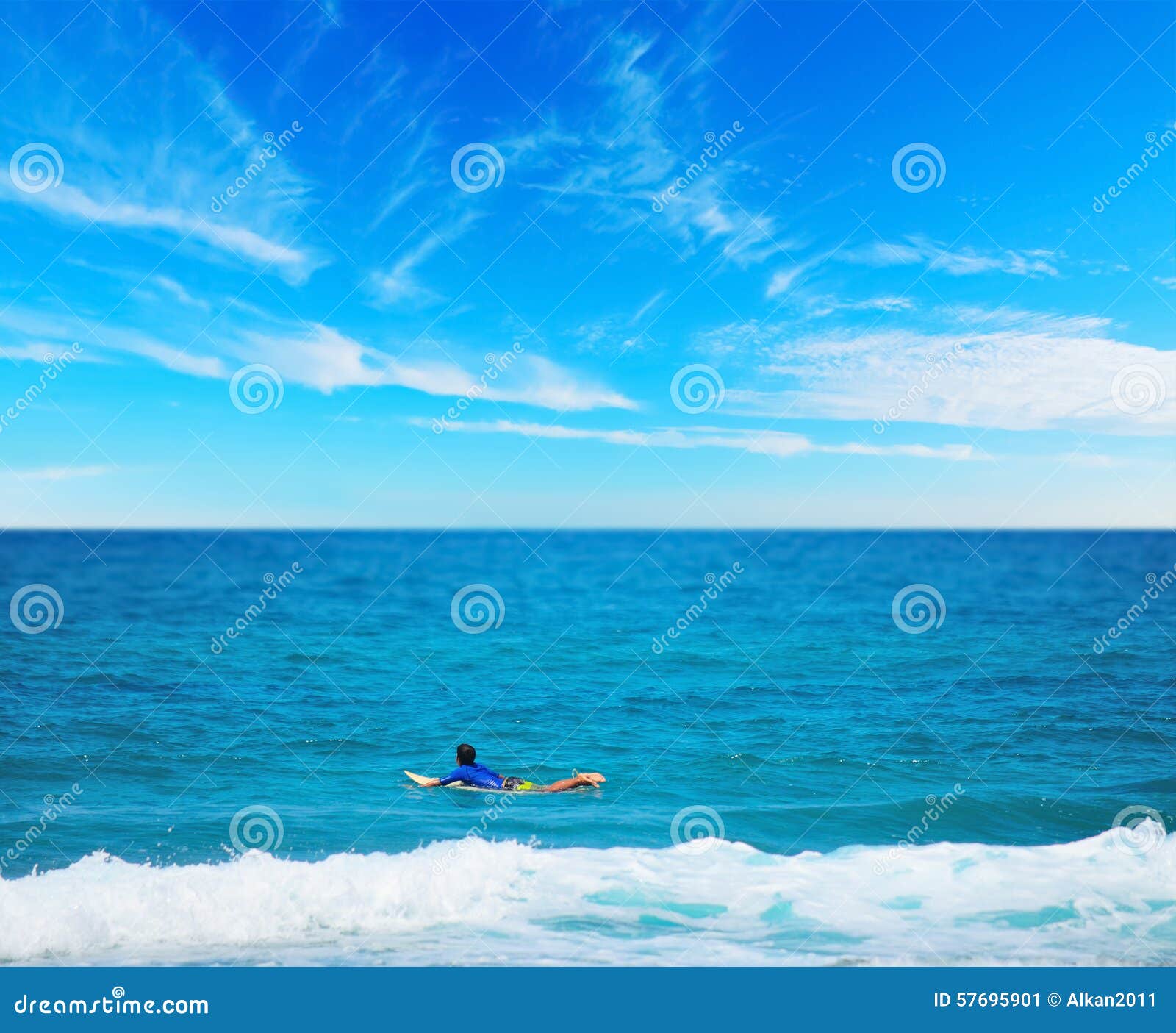Surfer Paddling on a Surfboard Stock Image - Image of italy, exercise ...