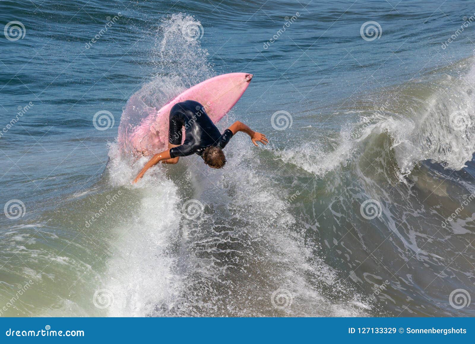 Surfer on Pnk Surfboard Atop a Wave Editorial Stock Image - Image of ...