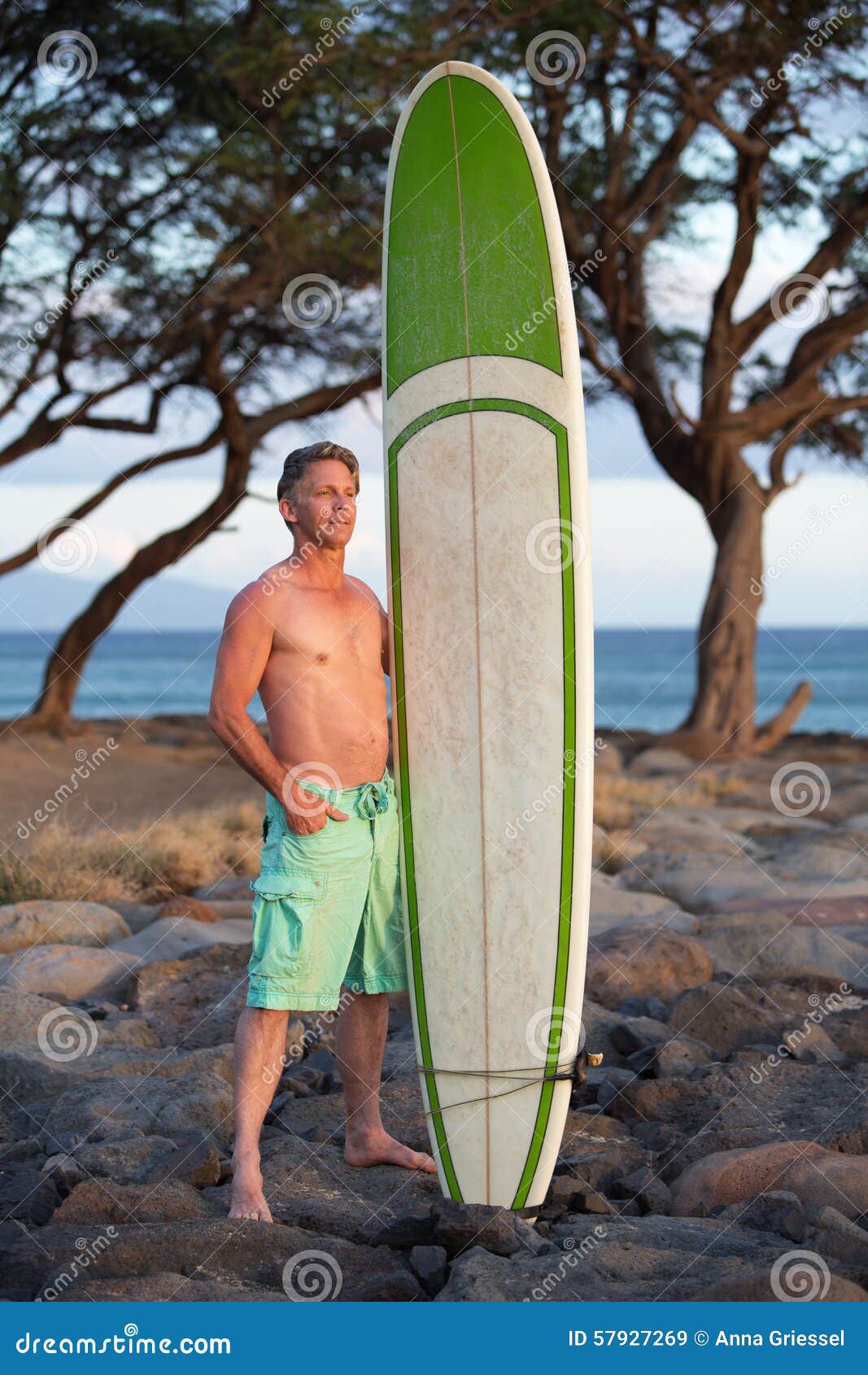 Surfer Posing with Surfboard Stock Image - Image of seashore, athletic ...