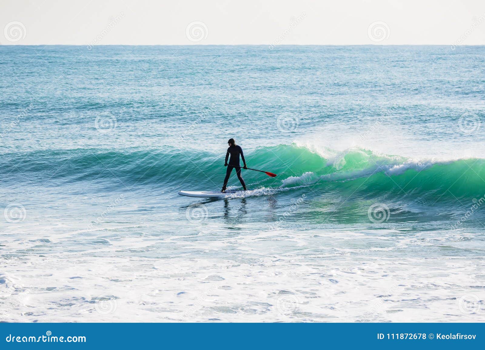 Surfer Ride on Stand Up Paddle Board on Ocean Blue Wave. Stock Photo ...