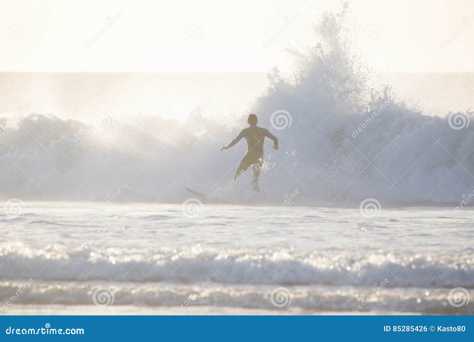 Surfer riding a big wave. stock photo. Image of coast - 85285426
