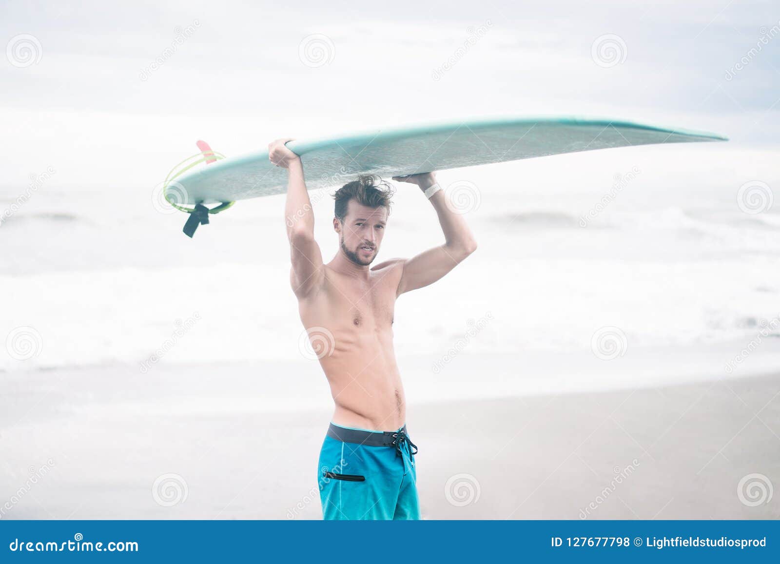 Surfer Standing with Surfboard on Head and Looking at Camera Stock ...