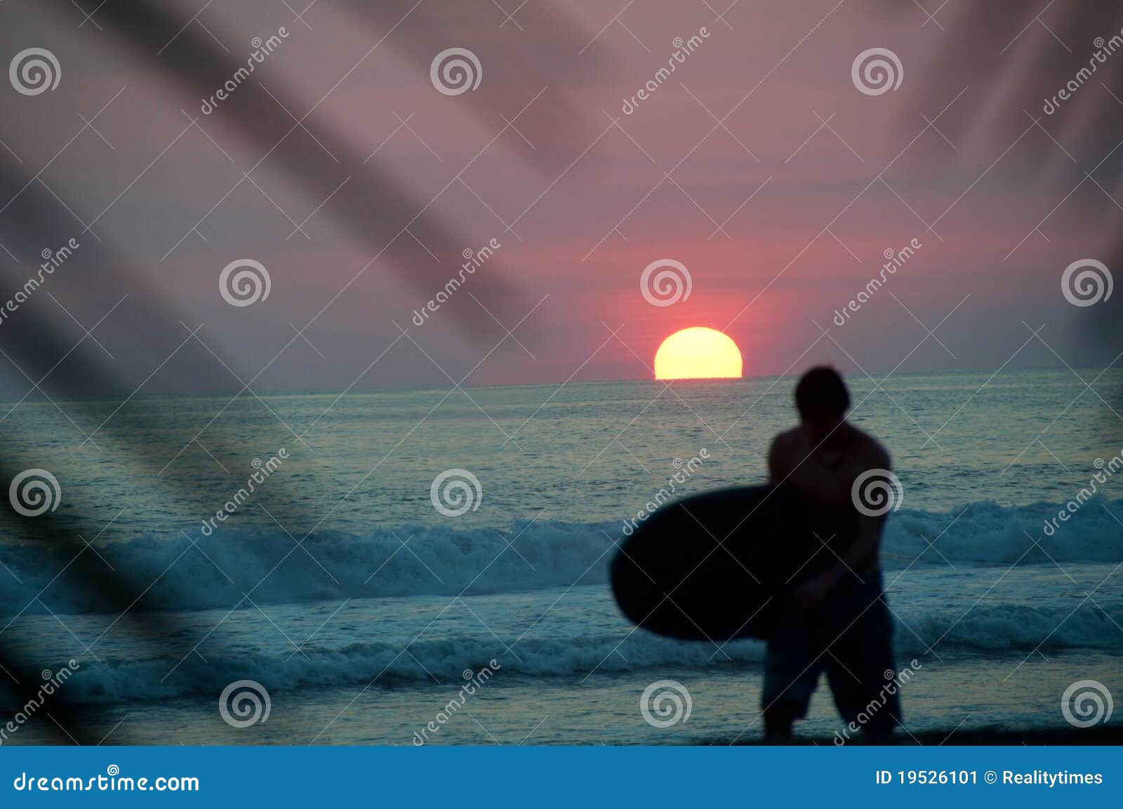Surfer at Sunset stock image. Image of water, board, shore - 19526101