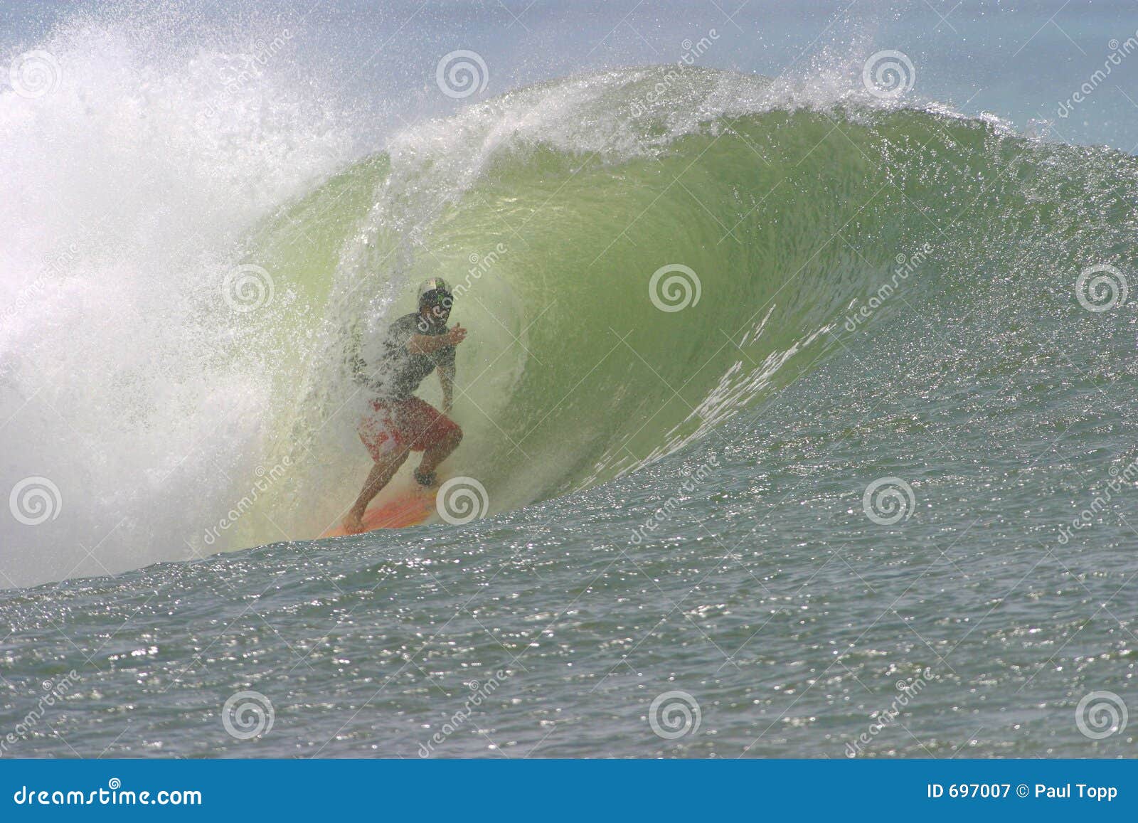 Surfer Surfing the Tube of a Wave Stock Image - Image of ocean, surfer ...