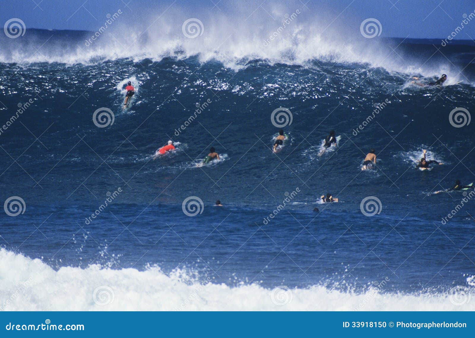 Surfers Paddling Out To Catch Wave Stock Photo - Image of catching ...
