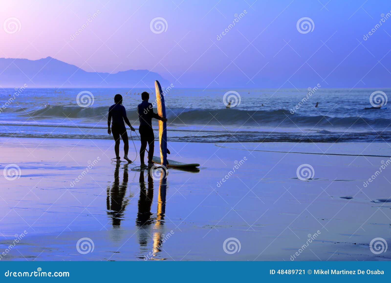 Surfers with Sunset Reflection on Surfboard Stock Image - Image of ...