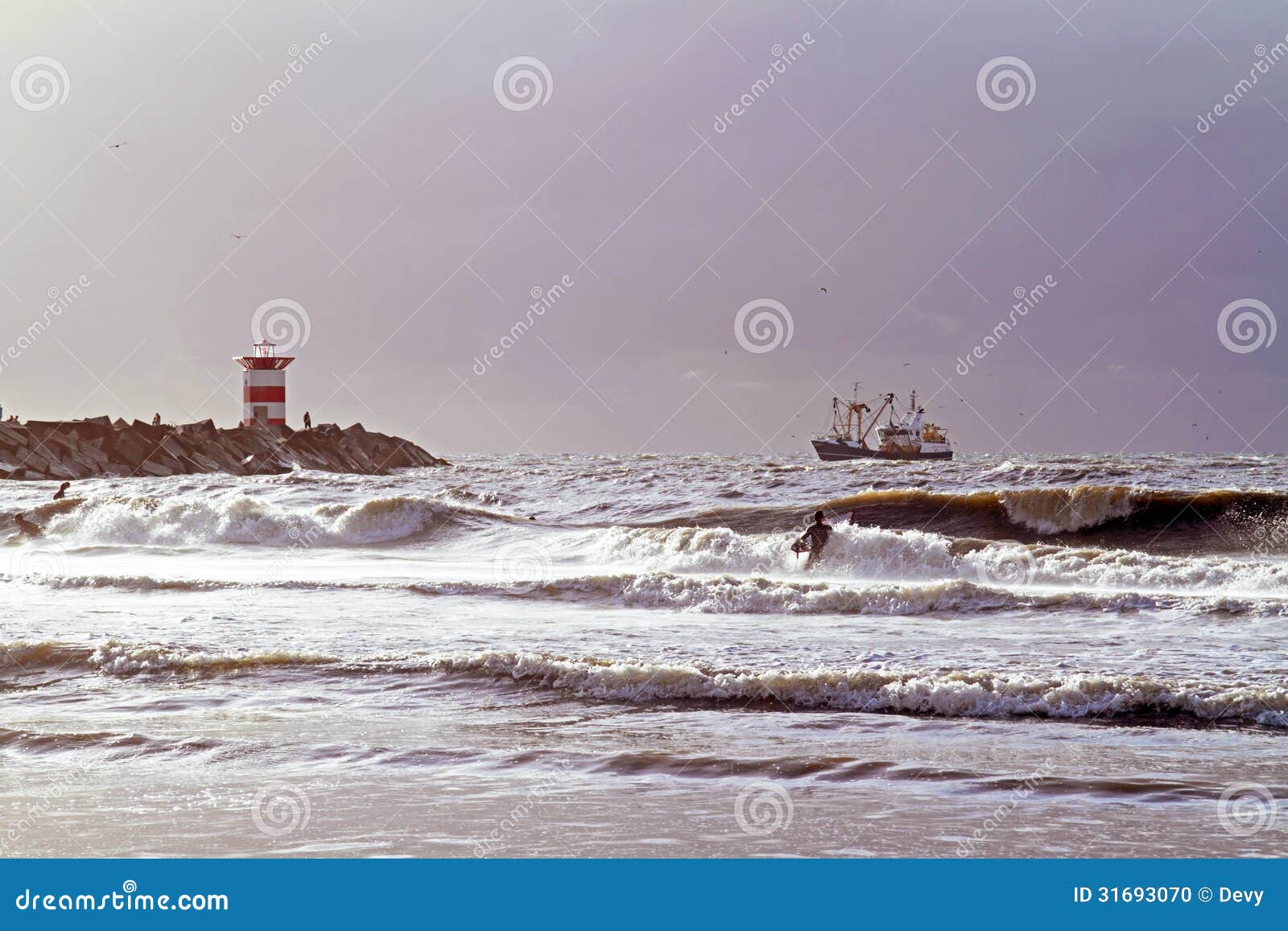 Surfers Surfing at Sunset in Scheveningen Netherlands Stock Photo ...