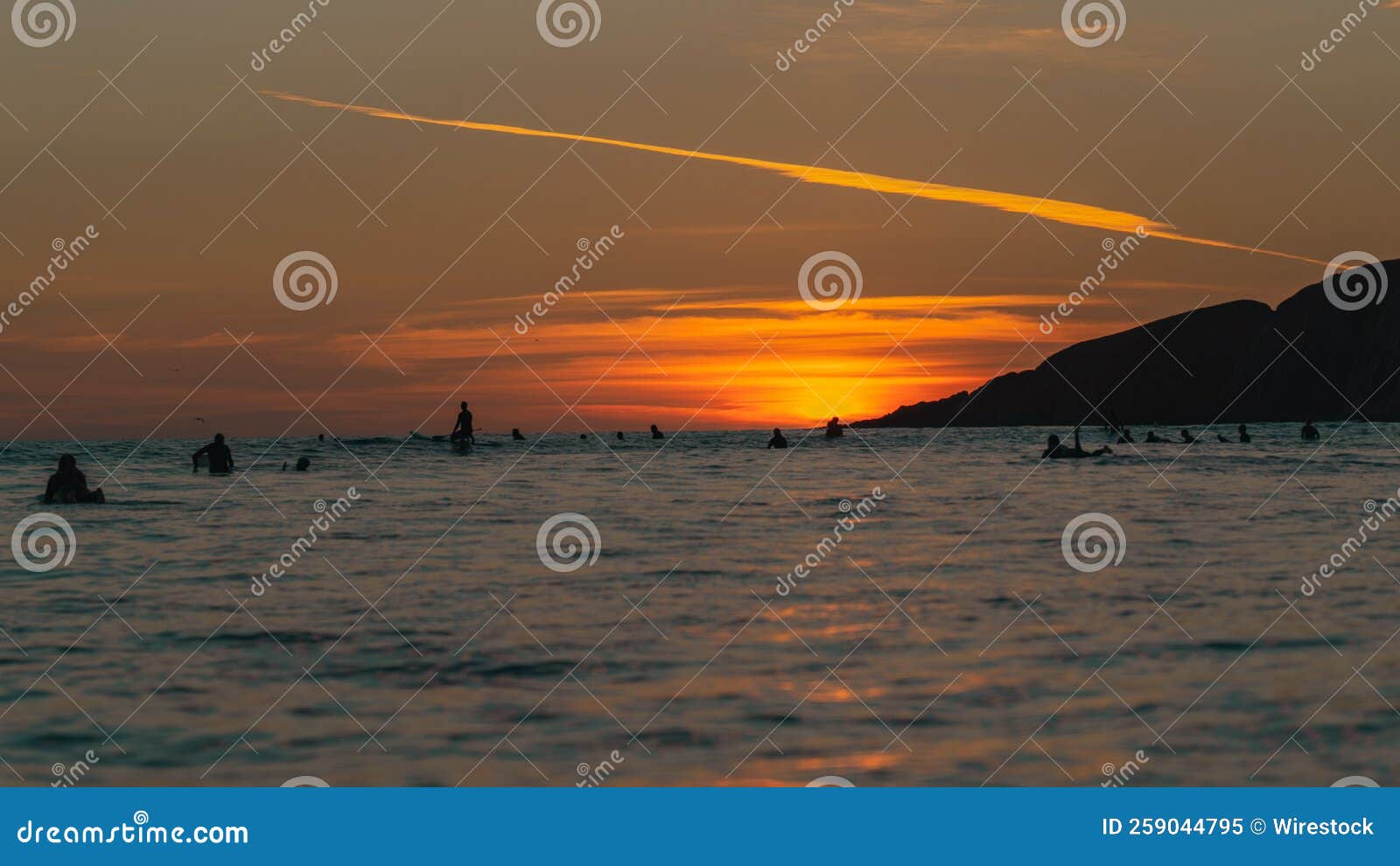 Surfing during the Beautiful Sunset Stock Image - Image of summer, dusk ...
