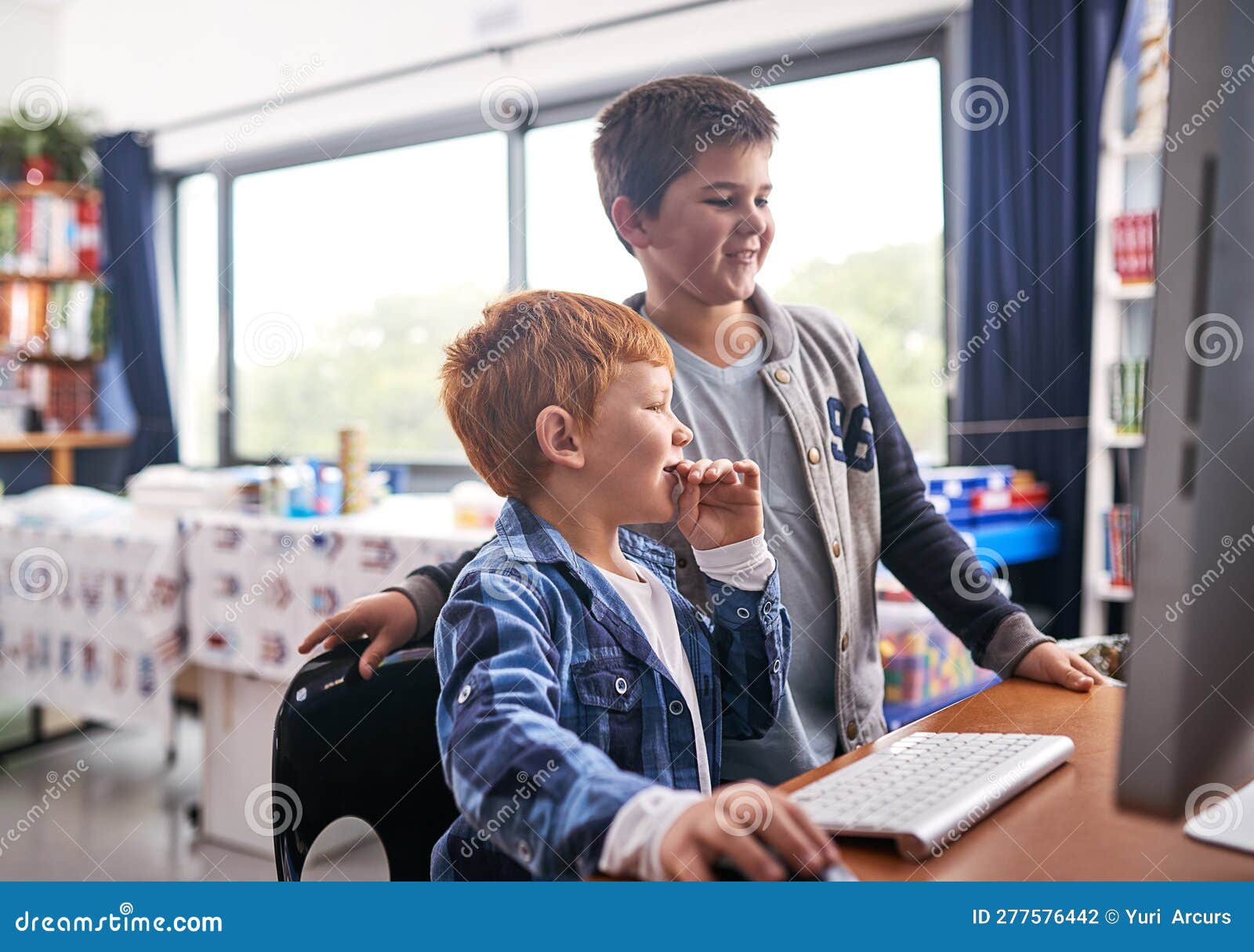 Surfing the Internet with My Buddy. Elementary School Children in Class ...