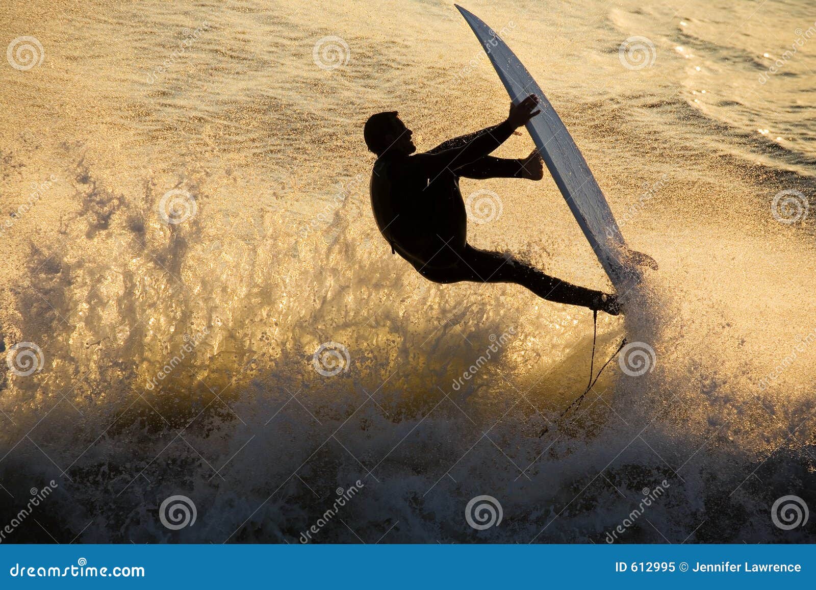 Surfing at Sunset stock image. Image of jump, daring, hanging - 612995