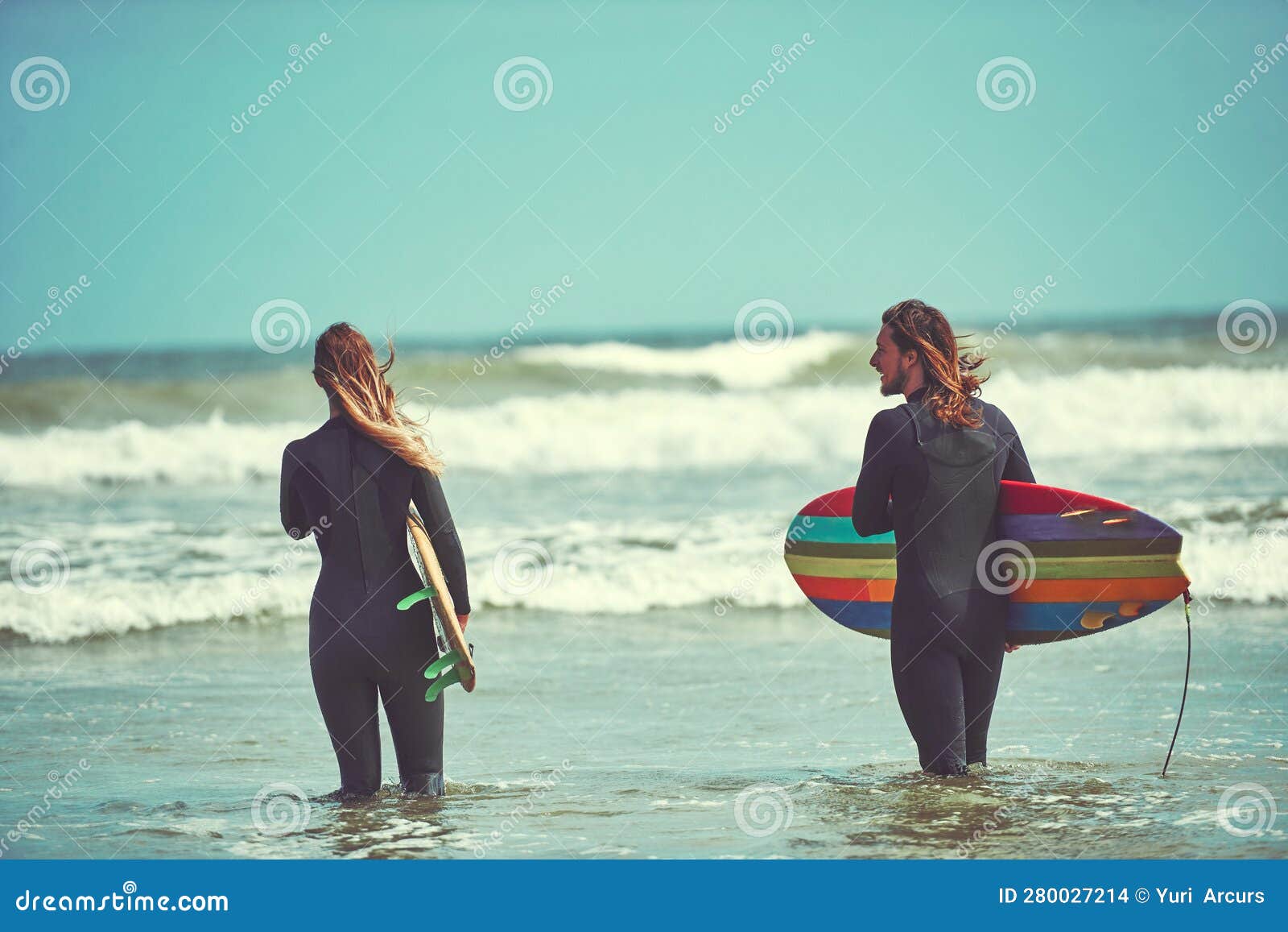 Surfing Vacay with Bae. a Young Couple Surfing at the Beach. Stock ...