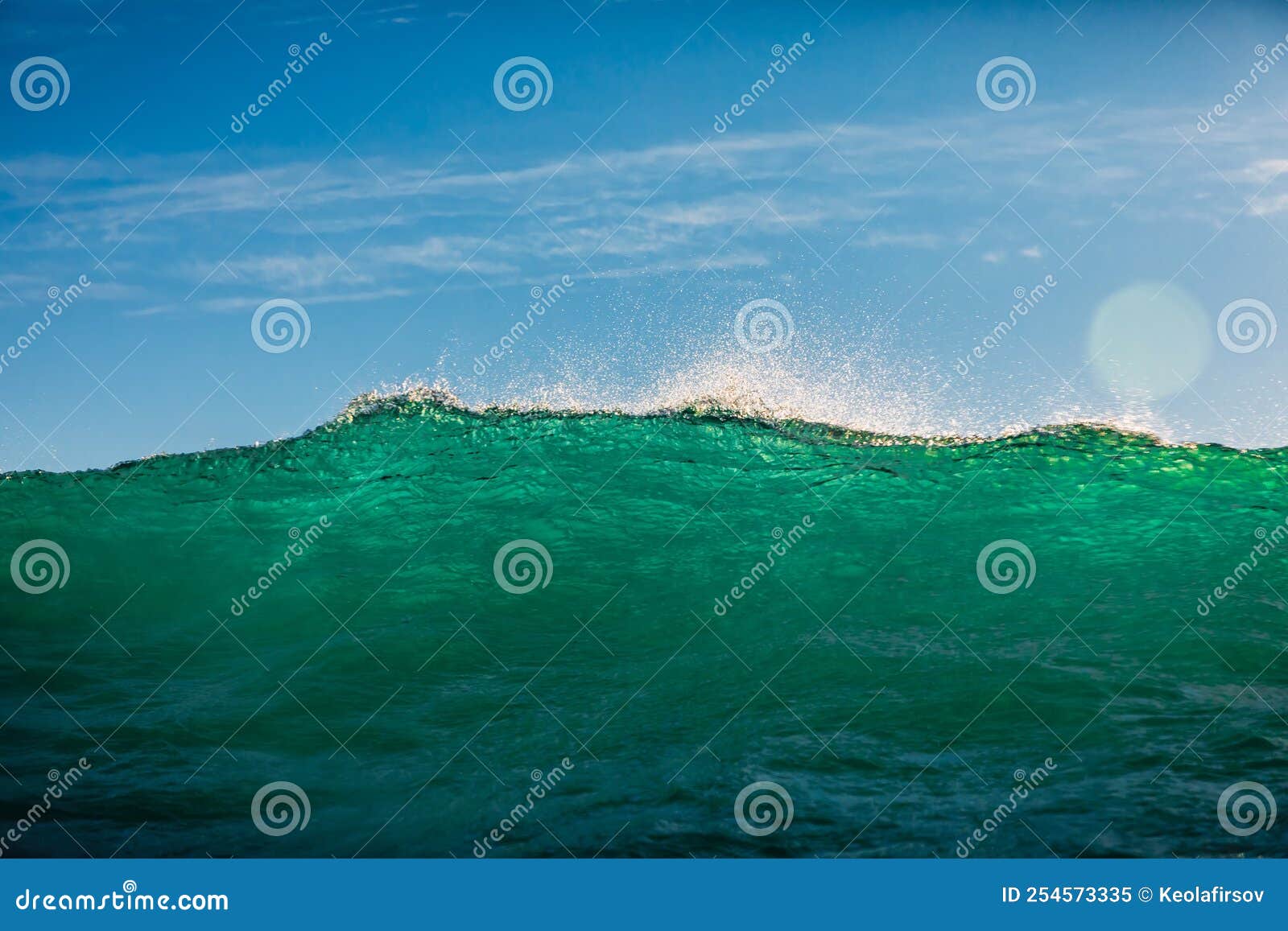Surfing Wave with Drops. Breaking Ocean Wave with Sunshine Stock Image ...