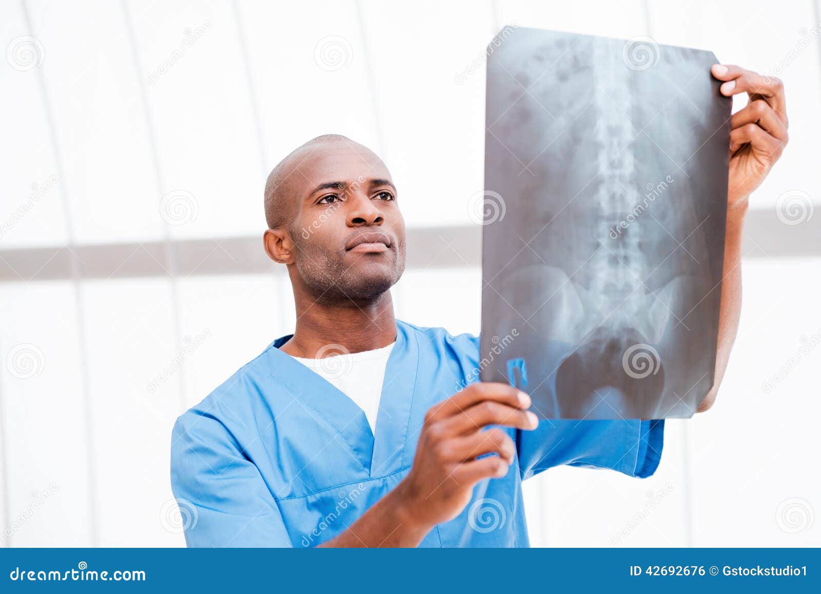 Surgeon Examining X-ray Image. Stock Photo - Image of concentration ...