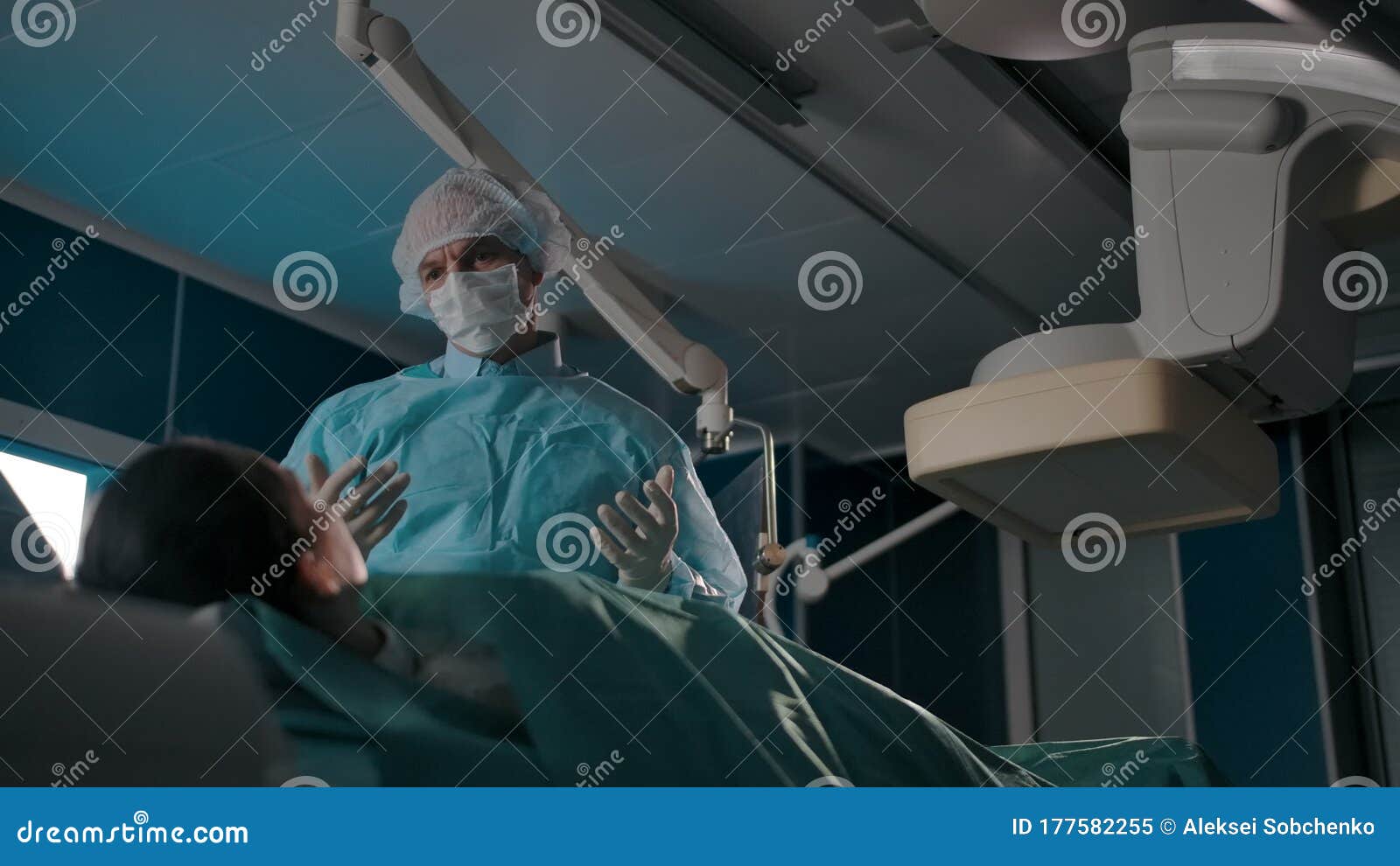Surgeon Explains Treatment Plan for Patient on Operating Table Stock ...
