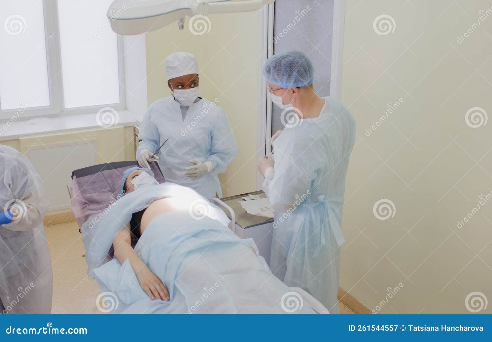 The Surgeon and His Assistant are Preparing for the Operation of a ...
