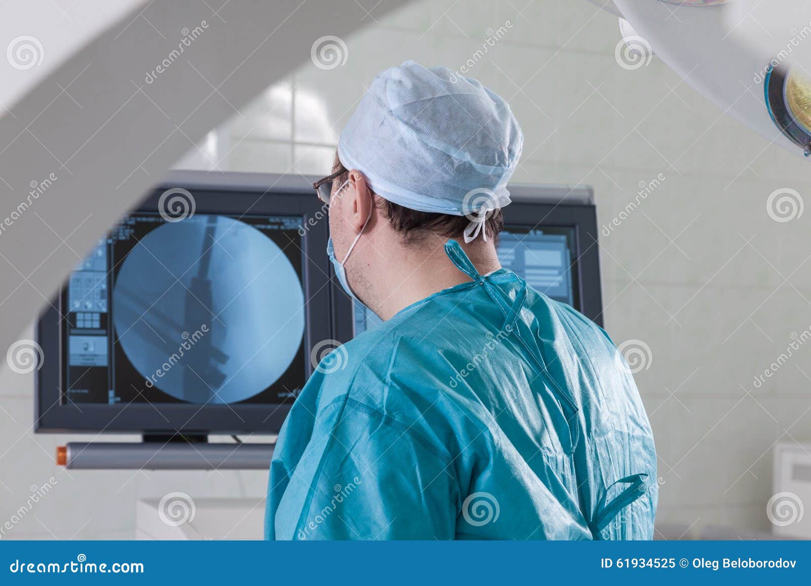 The surgeon at the monitor stock image. Image of patient - 61934525
