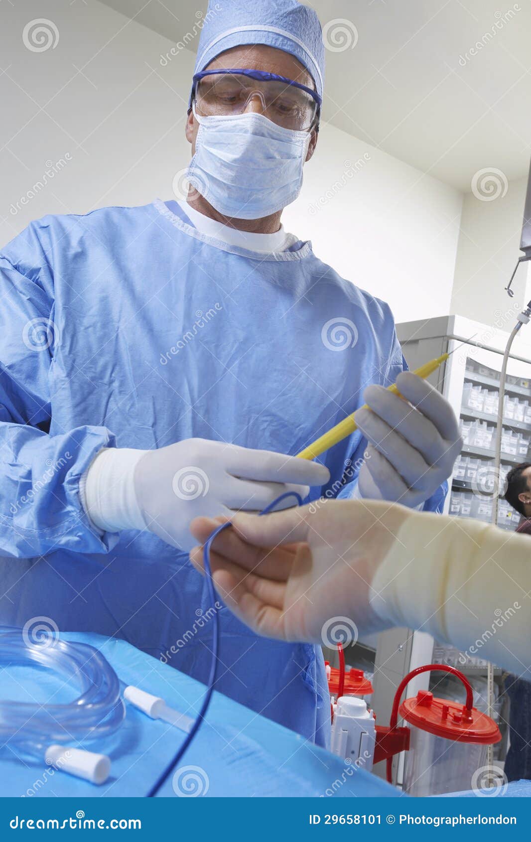 Surgeon in Operating Room stock image. Image of instrument - 29658101