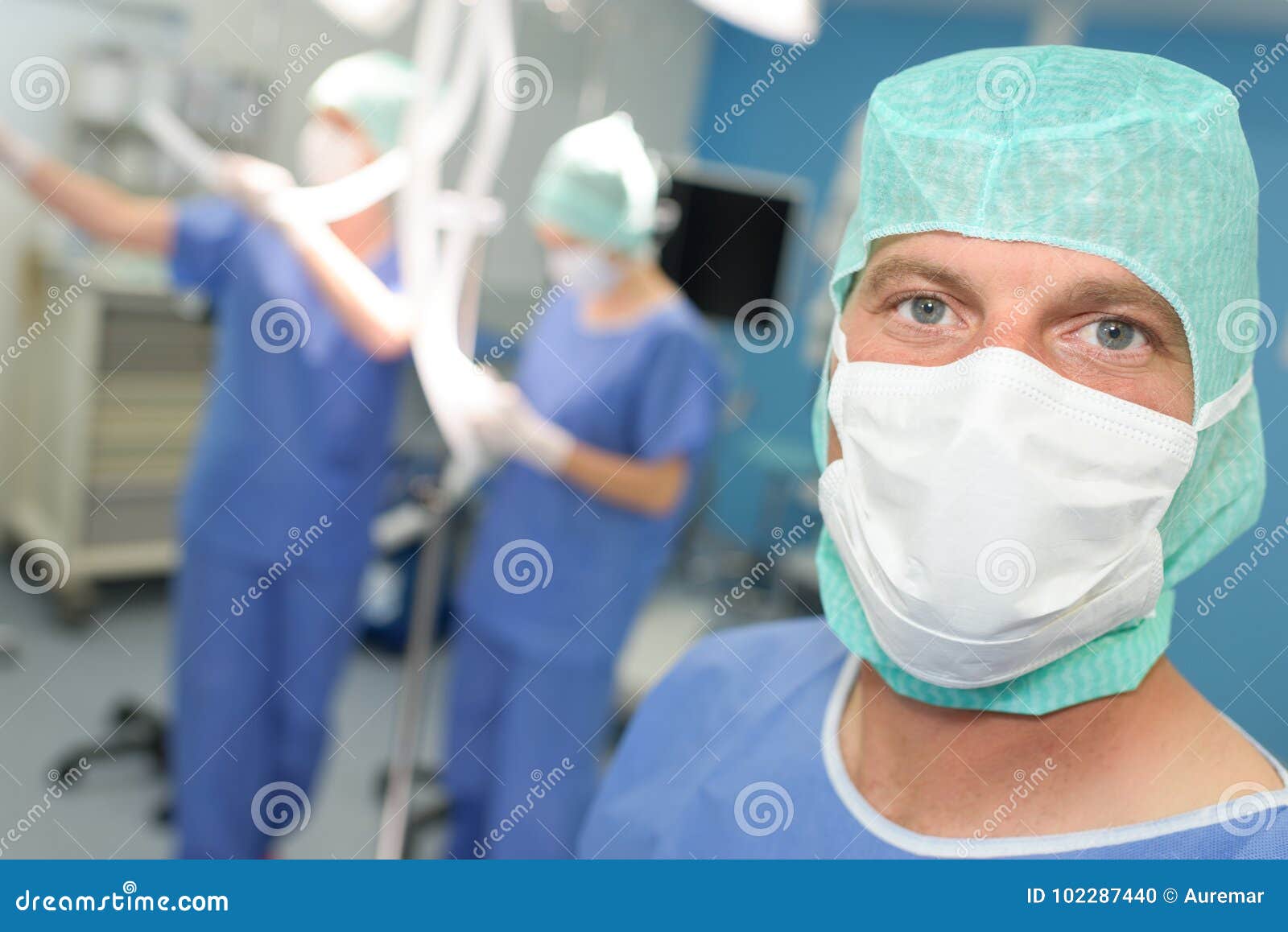 Surgeon in Operating Room with Co-workers Stock Photo - Image of modern ...