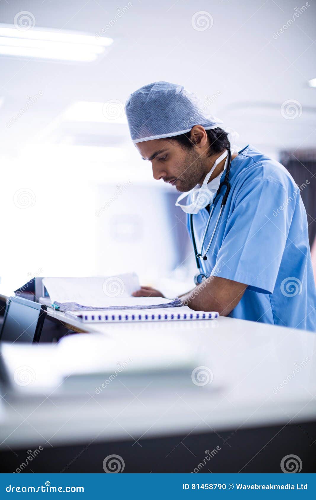 Surgeon Reading Medical Reports Stock Photo - Image of adult, reading ...