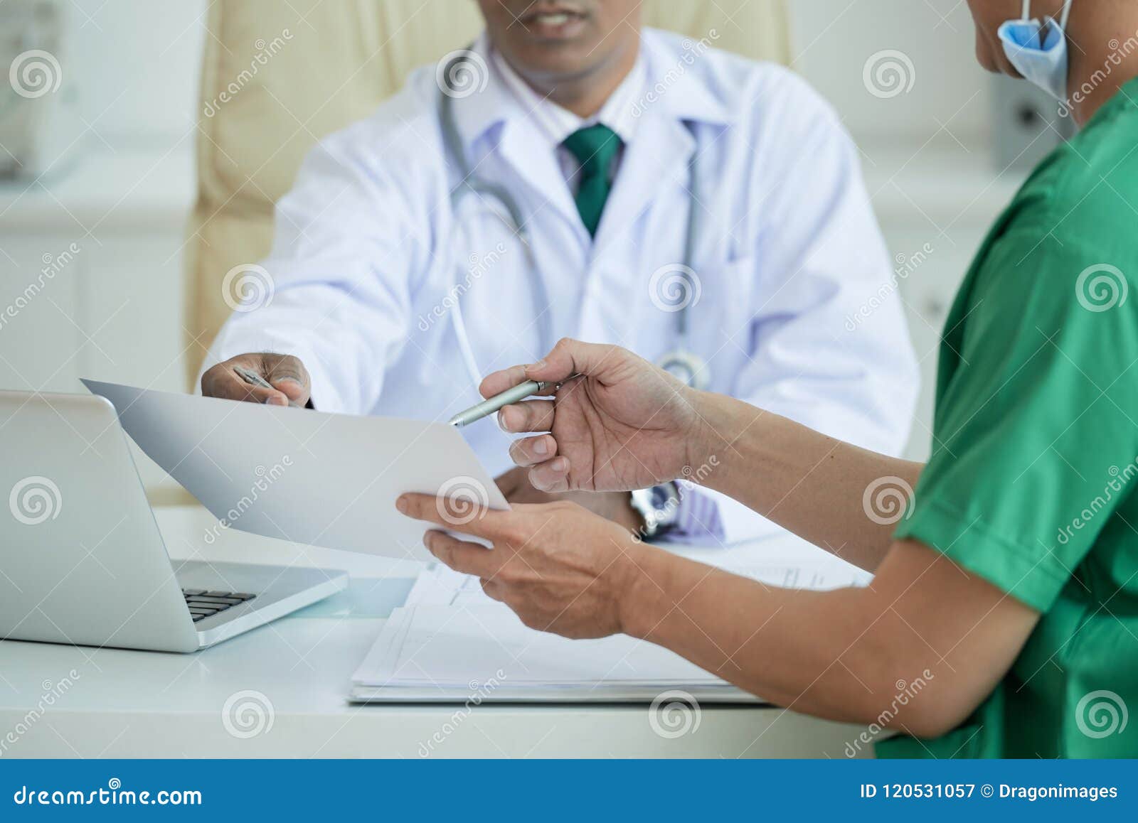Doctors Discussing Medical Report Stock Image - Image of showing, hands ... Doctors Discussing Medical Report Stock Image - Image of showing, hands ...