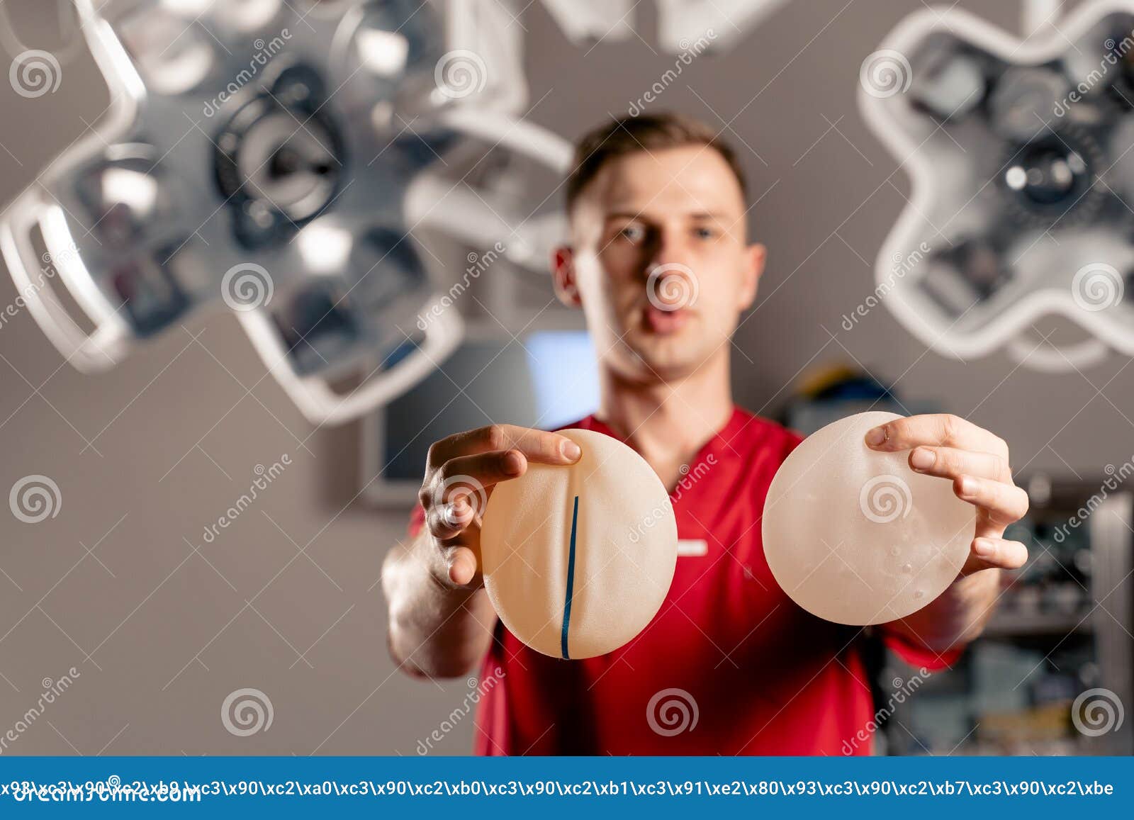 The Surgeon Shows Different Types of Silicone Implants. Breast ...
