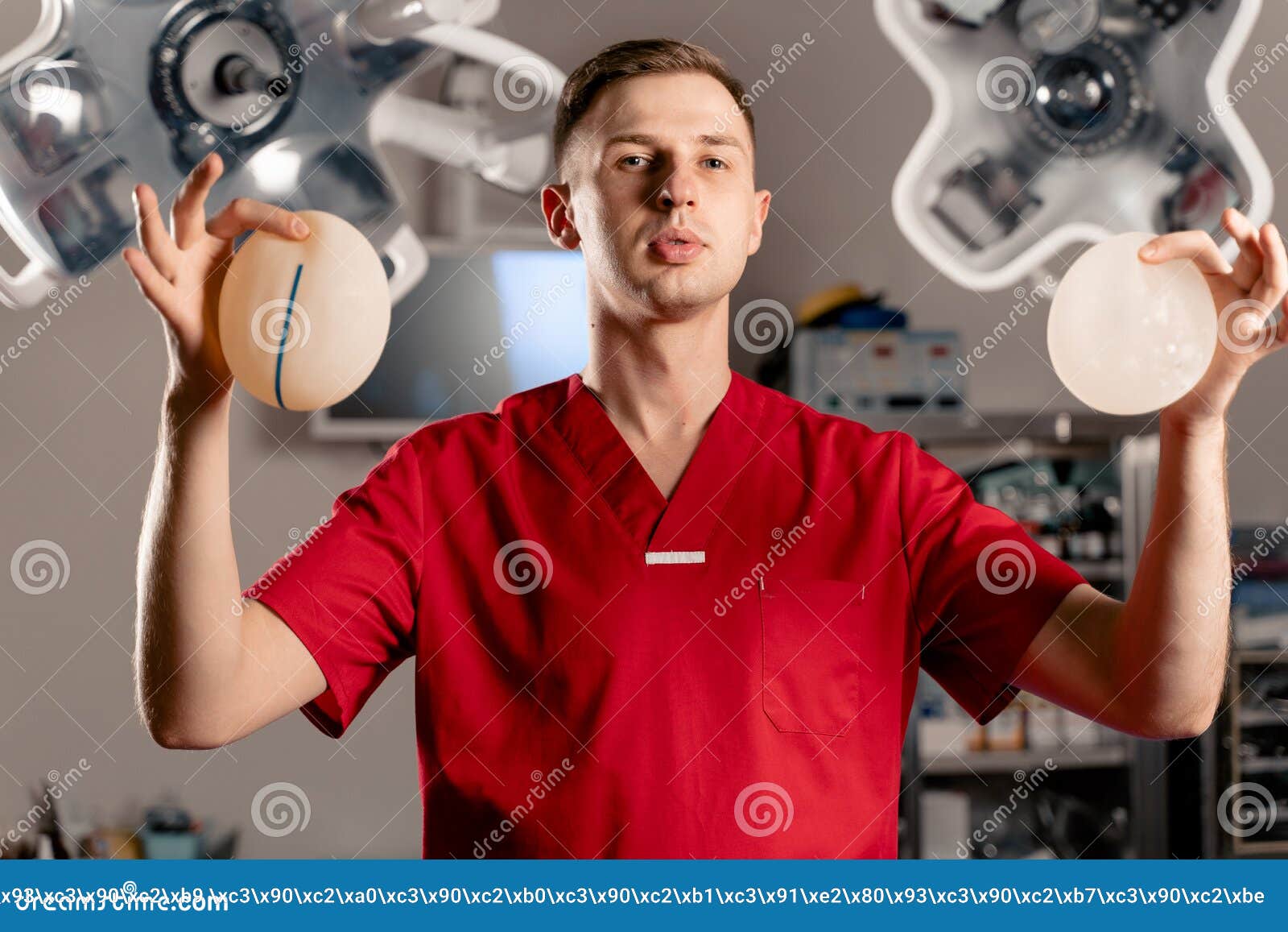 The Surgeon Shows Different Types of Silicone Implants. Breast ...