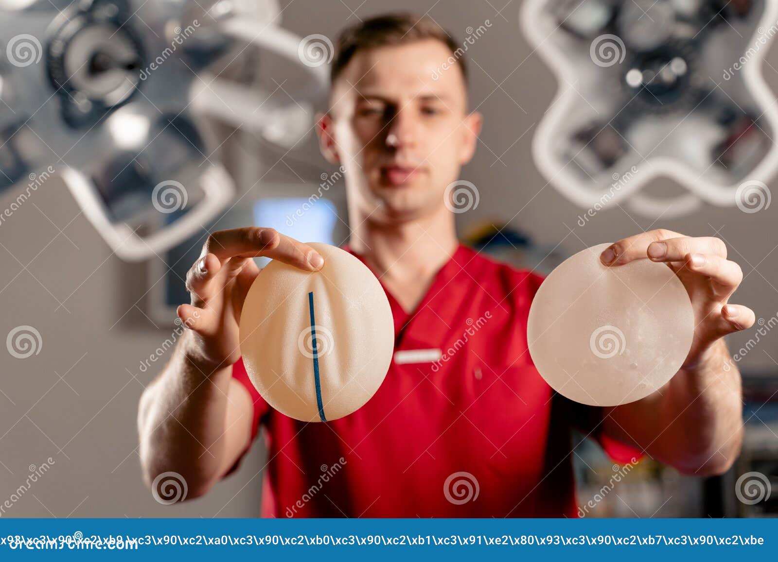 The Surgeon Shows Different Types of Silicone Implants. Breast ...