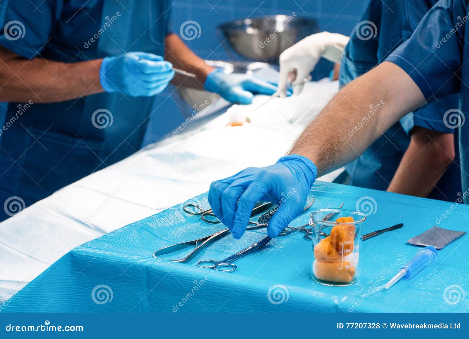 Surgeon Taking a Scissors from Tray Stock Photo - Image of scrubs ...