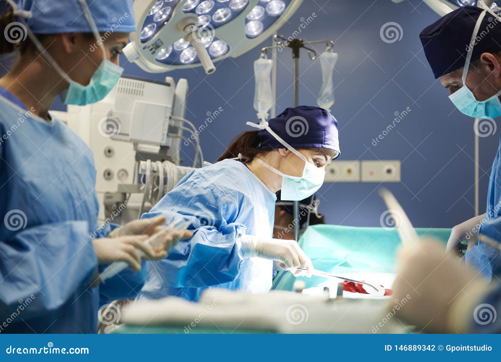Surgeon Using Medical Scissors during an Operation Stock Photo - Image ...