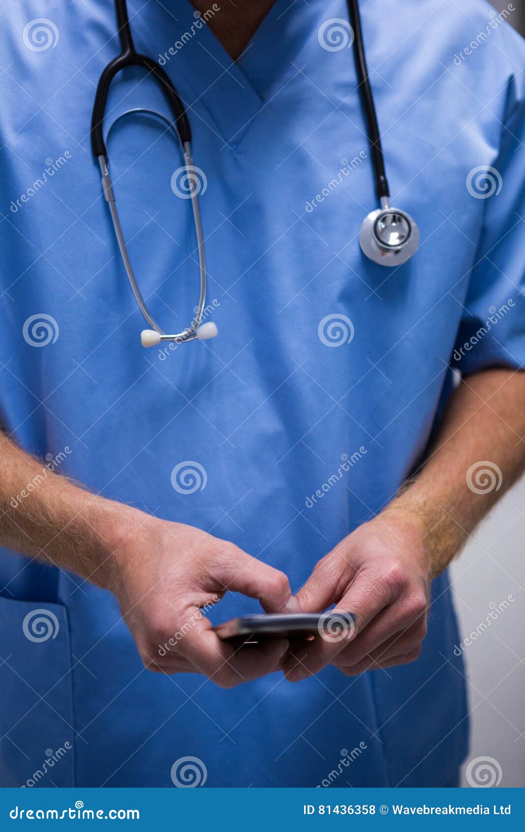 Surgeon Using Mobile Phone in Hospital Stock Photo - Image of messaging ...