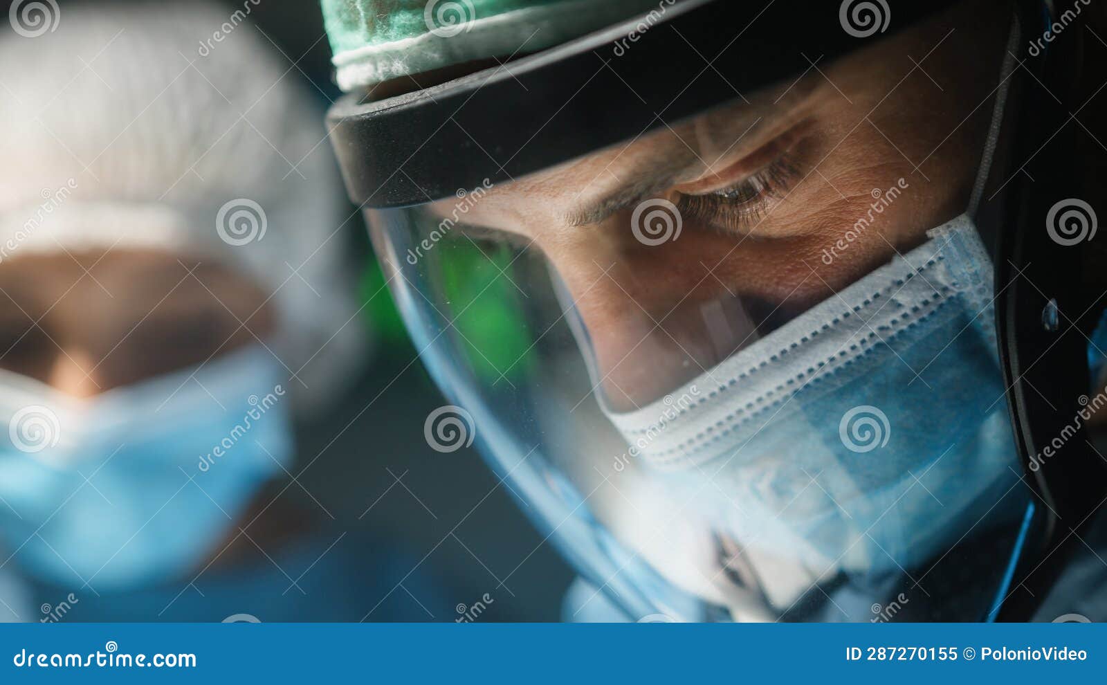 Surgeon with Visor and Surgical Mask Operates a Contagious Disease ...