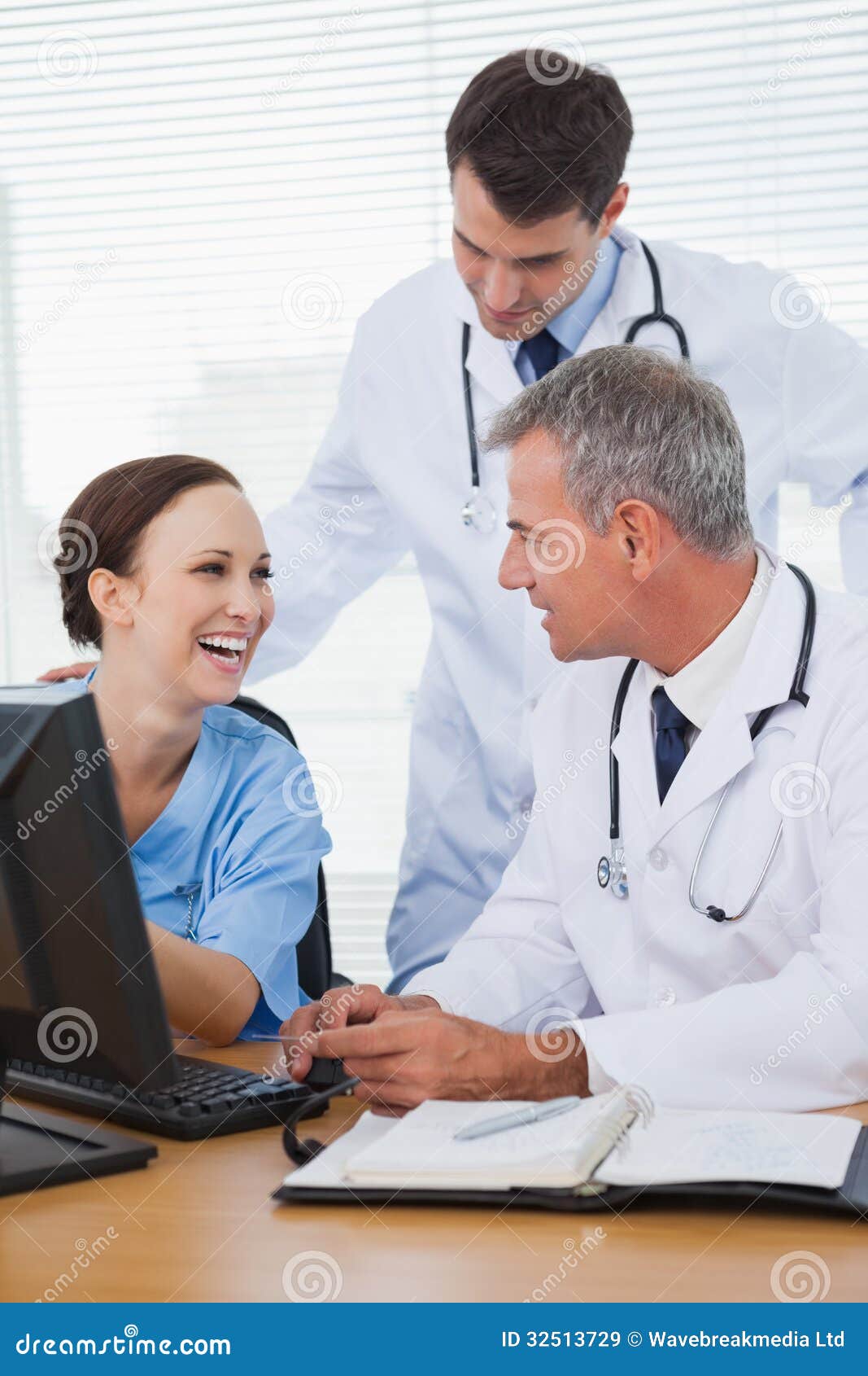 Surgeon Working with Doctors on Computer Stock Image - Image of ...