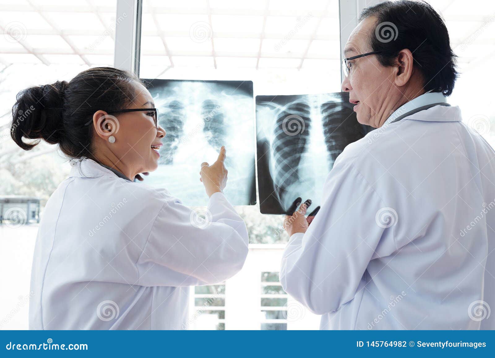 Surgeons Arguing about X-ray Results Stock Photo - Image of recovery ...