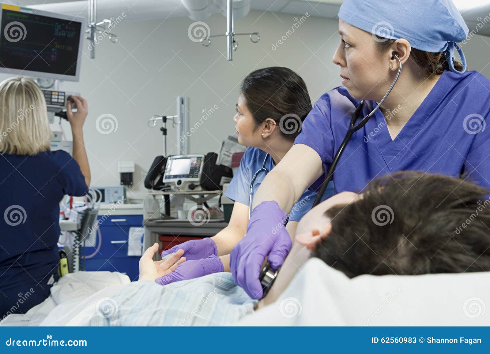 Surgeons checking patient stock image. Image of check - 62560983