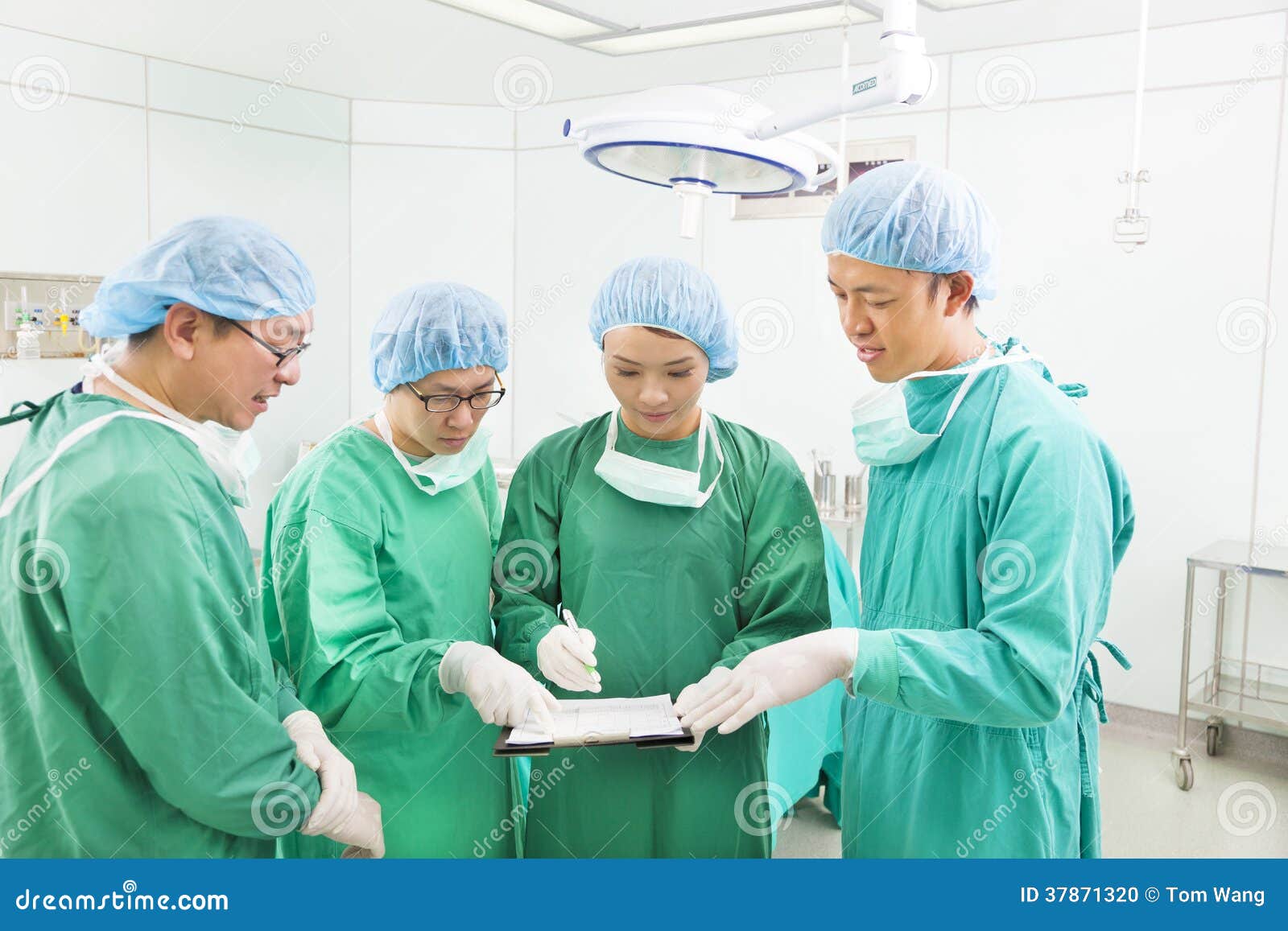 Surgeons Discussing about Something in Operating Theater Stock Photo ...