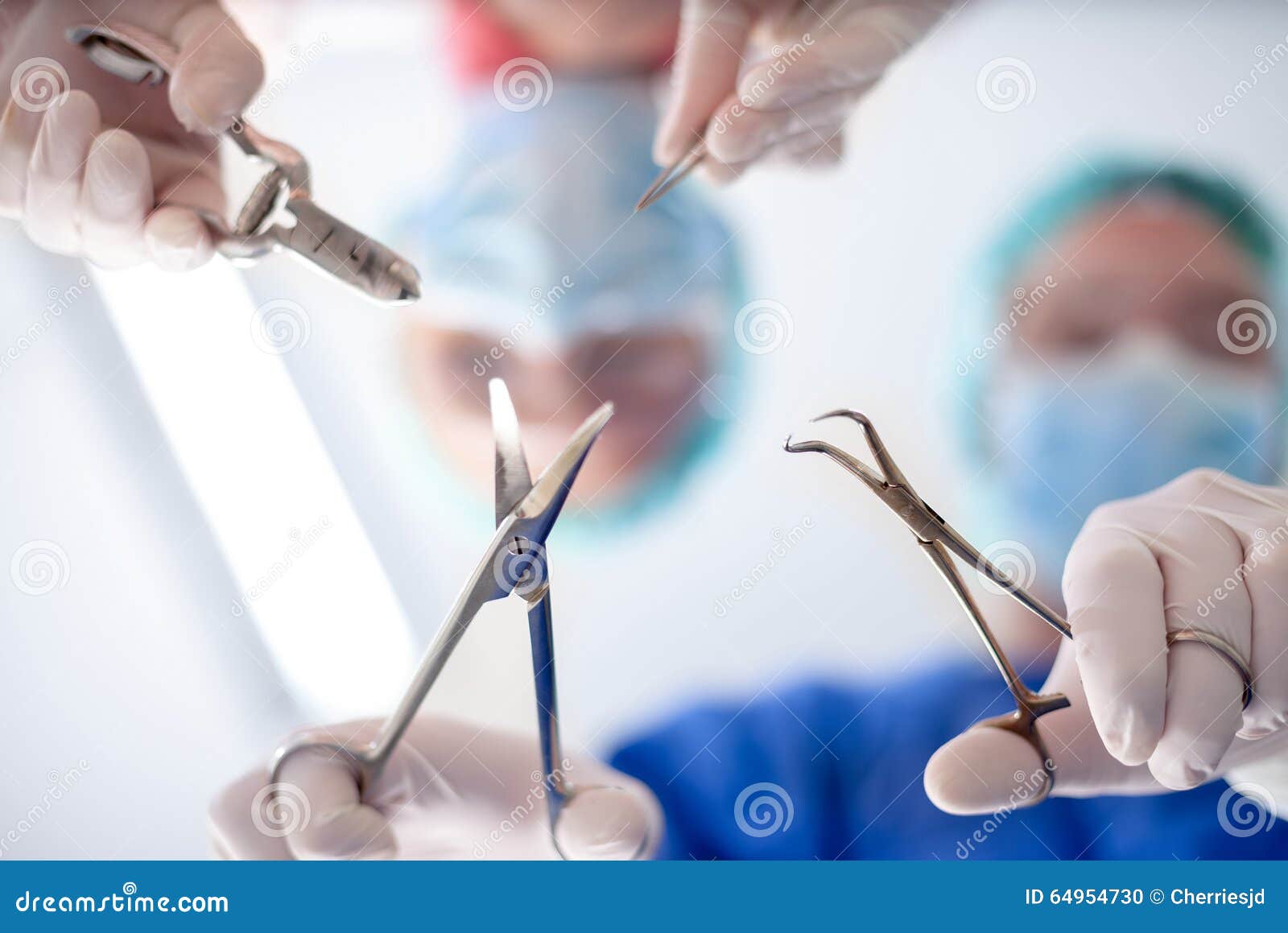 Surgeons Holding Medical Instruments in Hands and Looking at Pat Stock ...