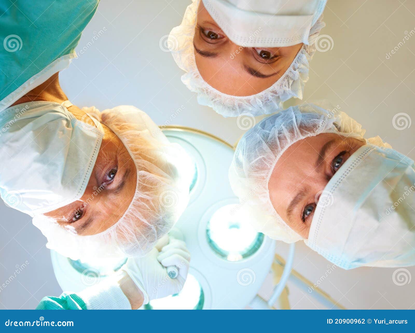 Surgeons Looking Down at Patient in Operation Room Stock Photo - Image ...