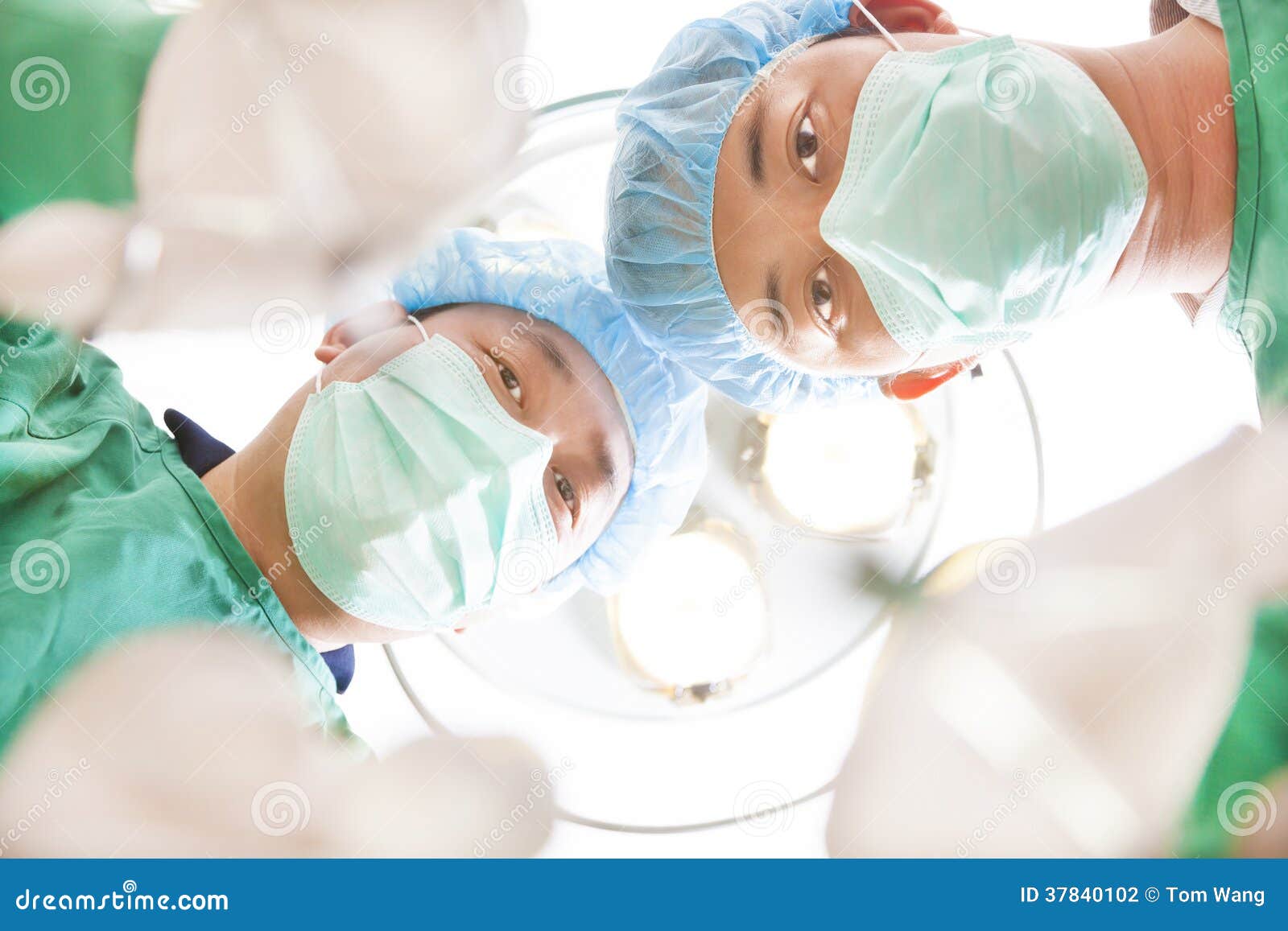 Surgeons and Medical Assistant Working in Operating Room Stock Photo ...