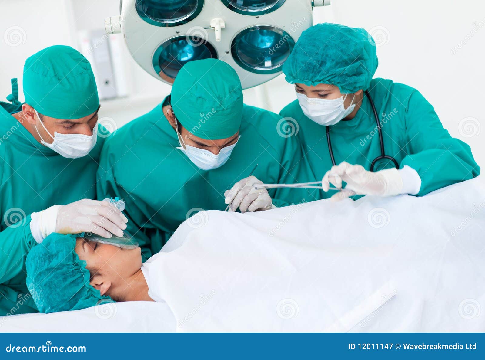 Surgeons Near Patient Lying on an Operating Table Stock Image - Image ...