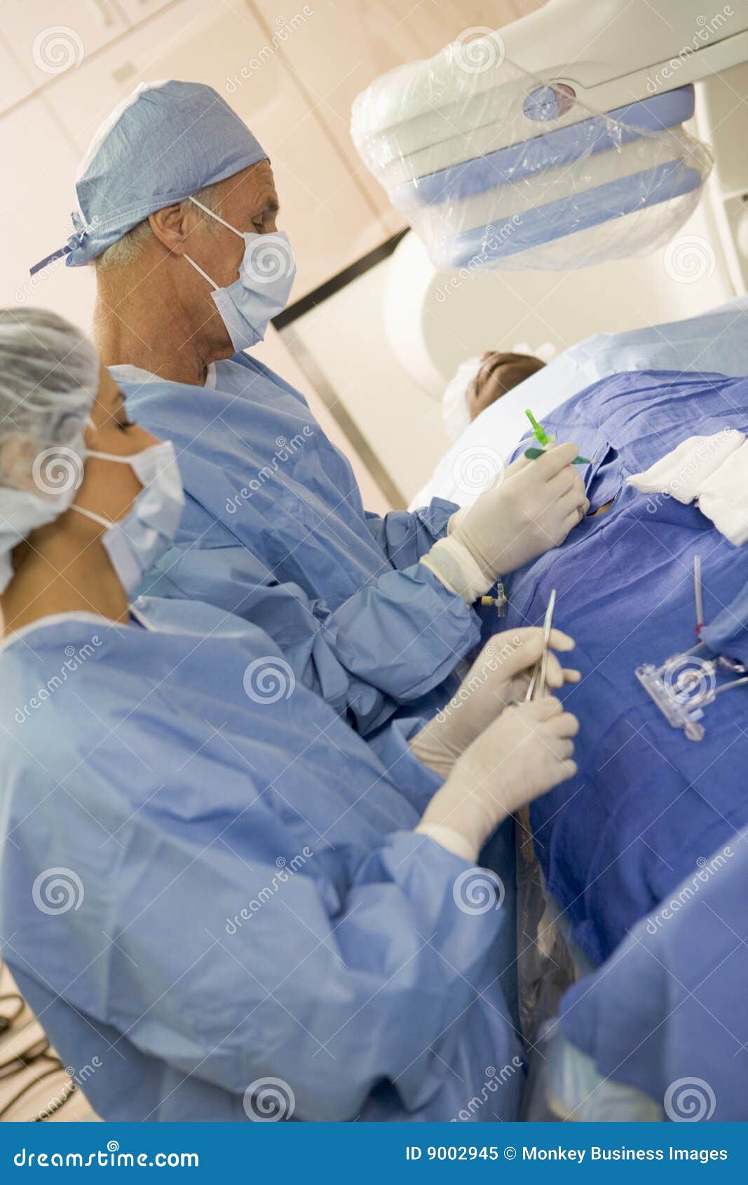 Surgeons Operating on Patient Stock Image - Image of adult, male: 9002945