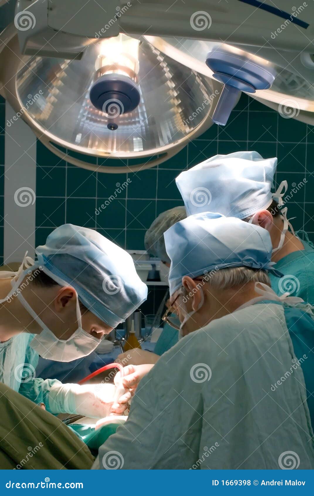 Surgeons in operation room stock photo. Image of mask - 1669398